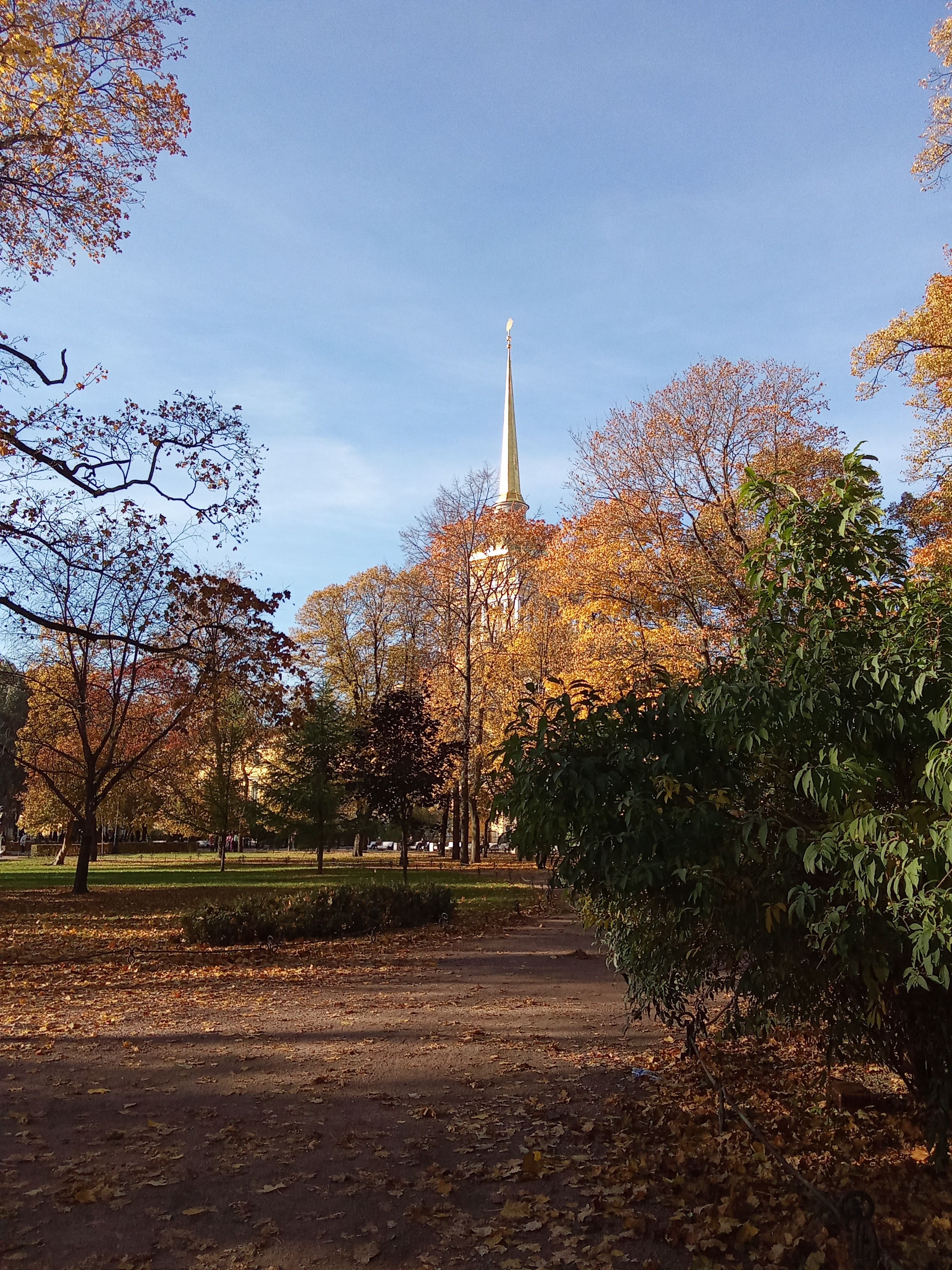 Scenic Autumn Park with Church Spire · Free Stock Photo