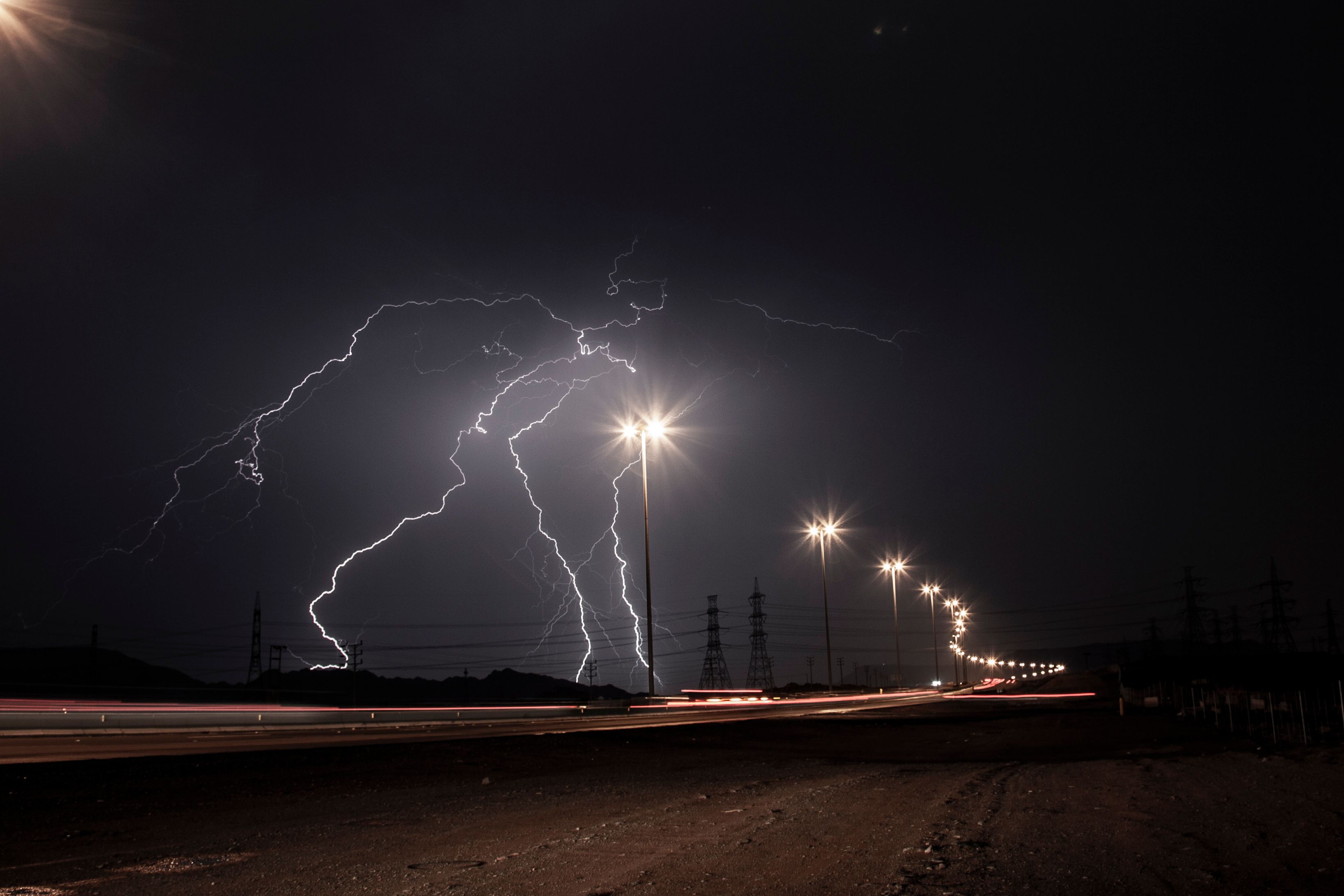 Dramatic Lightning Over Saudi Highway at Night · Free Stock Photo