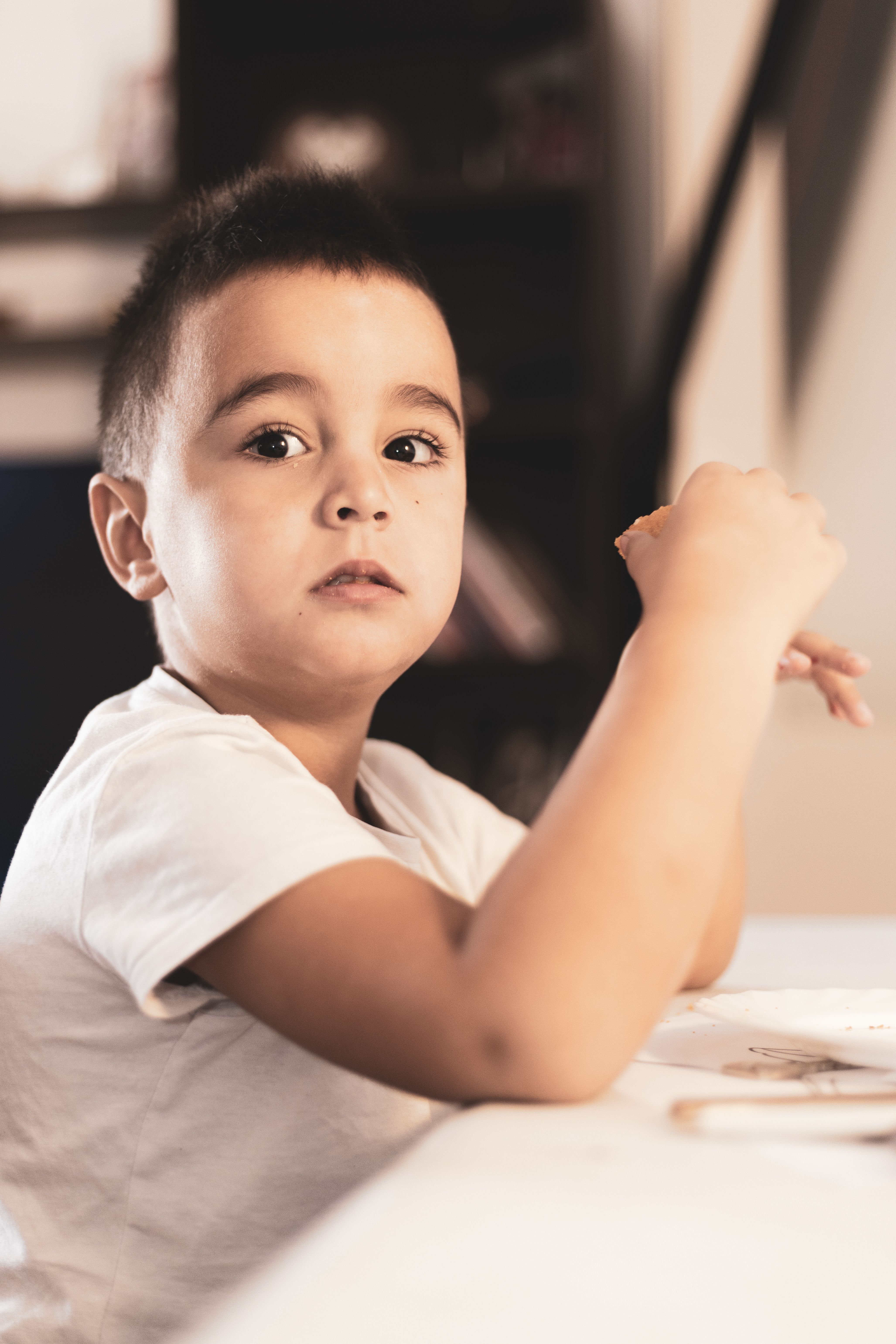 Portrait of a Thoughtful Child Indoors · Free Stock Photo