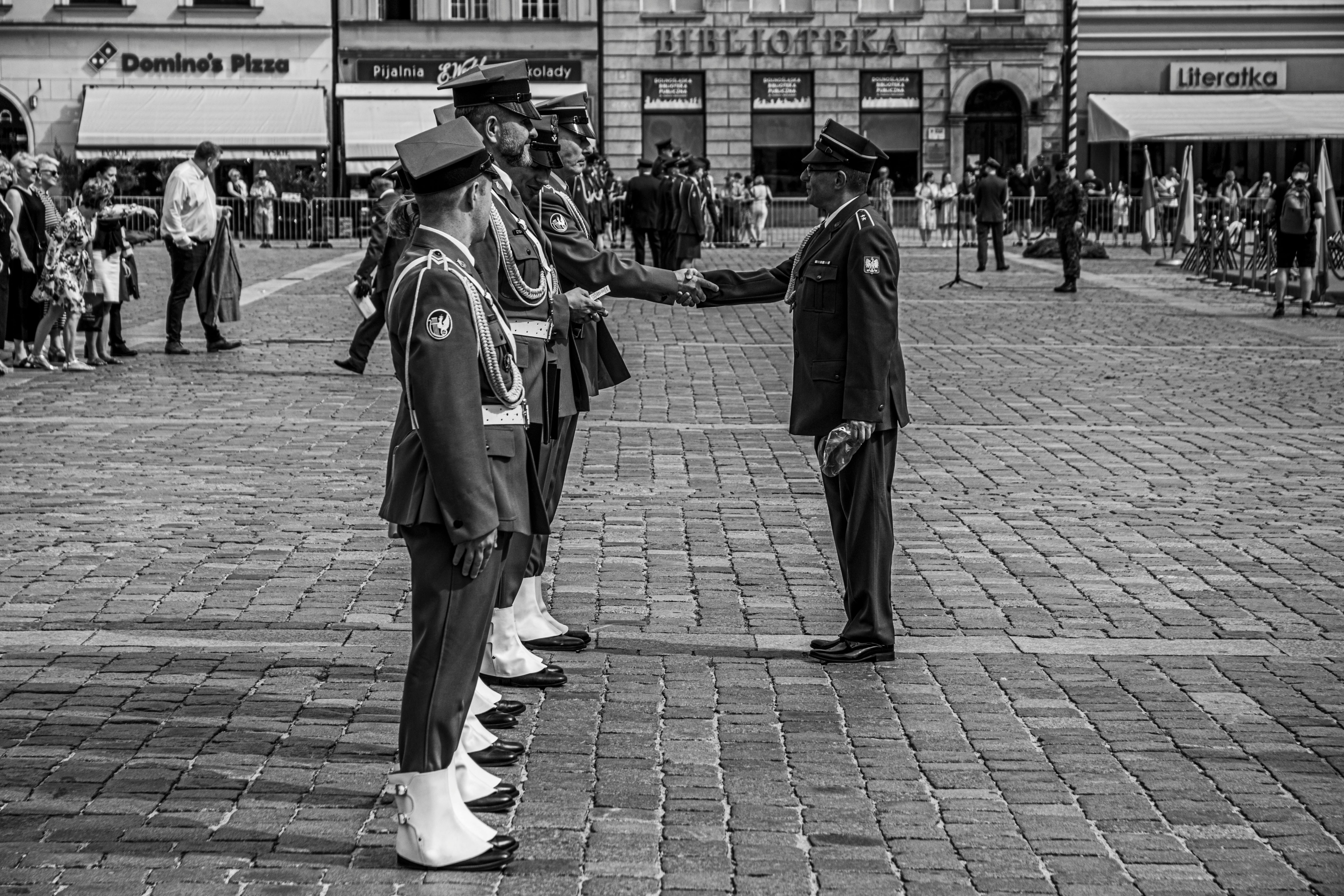 Uniformed Officers in Formal Ceremony on Cobblestone Square · Free ...
