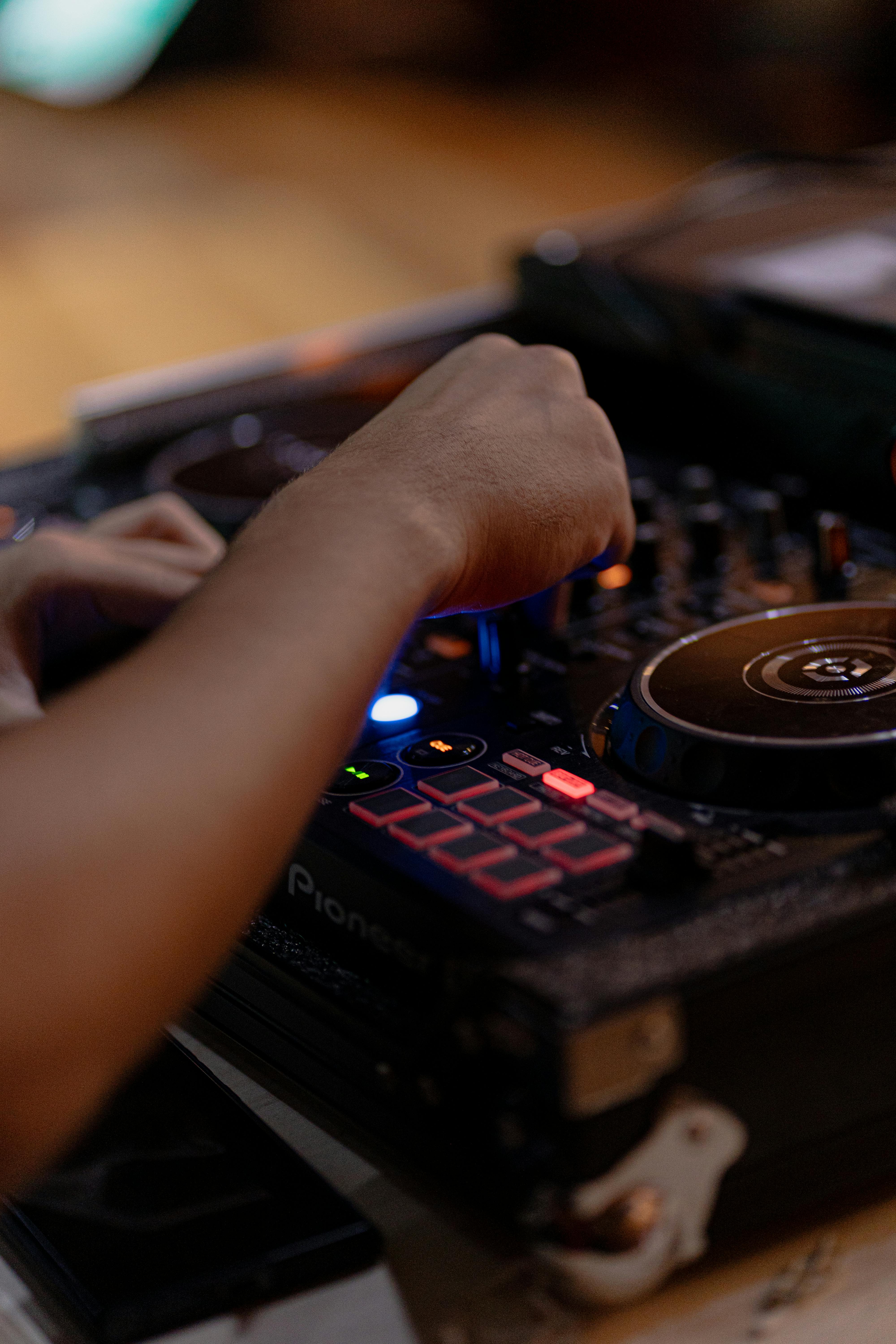 Photo of Person Holding Dj Controller · Free Stock Photo