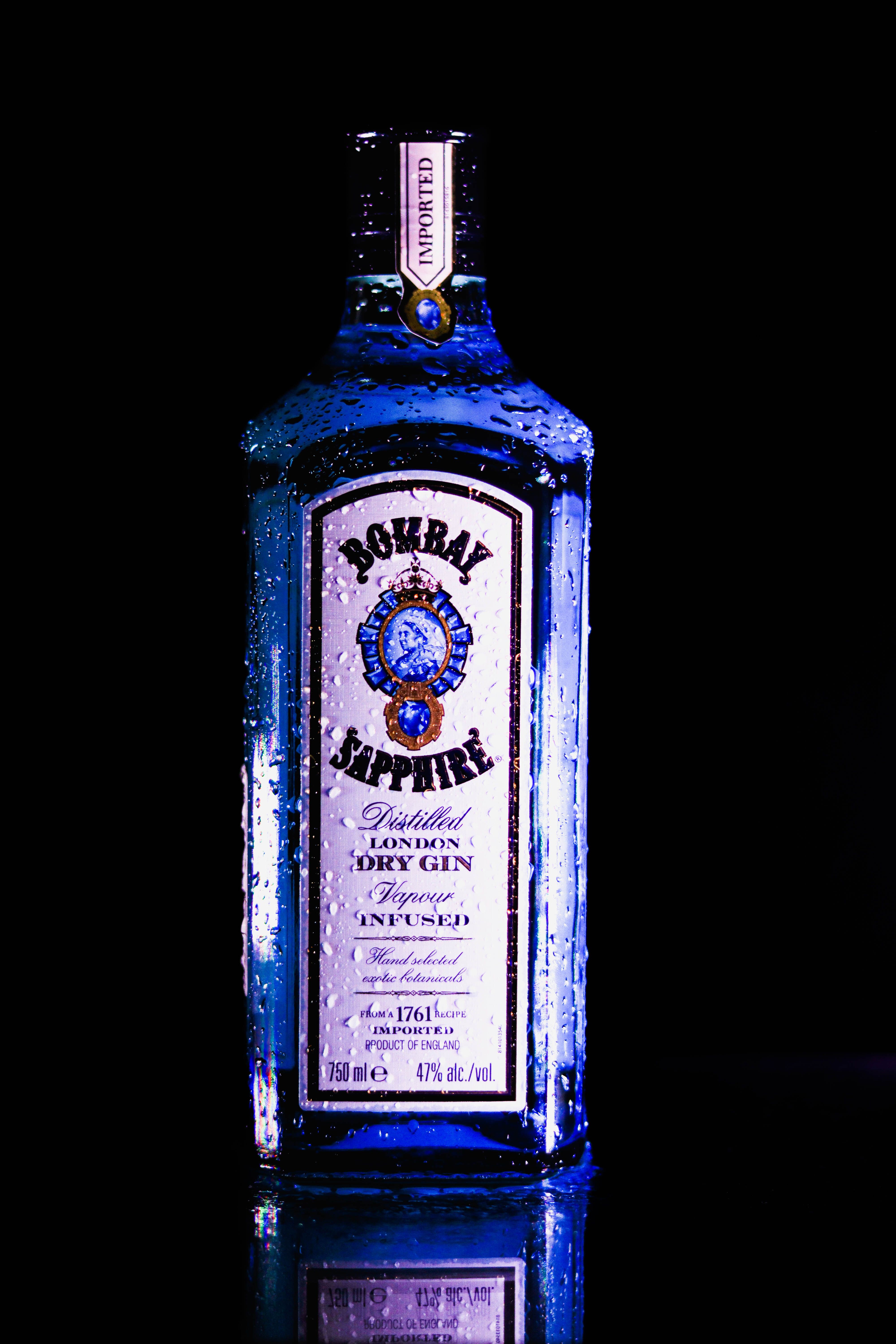 Illuminated Bombay Sapphire Gin Bottle on Black Background · Free Stock ...