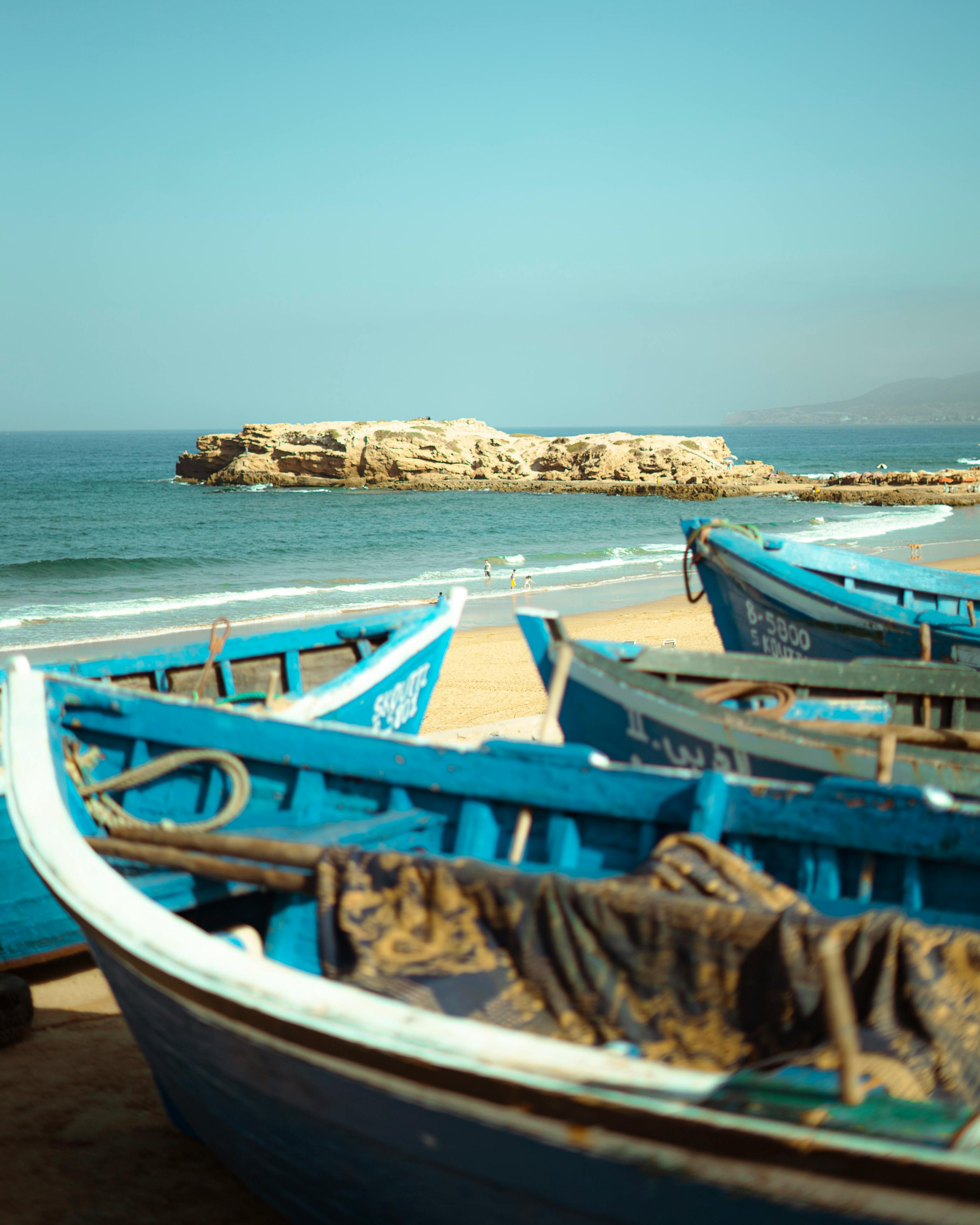 Traditional Blue Fishing Boats on Moroccan Beach · Free Stock Photo