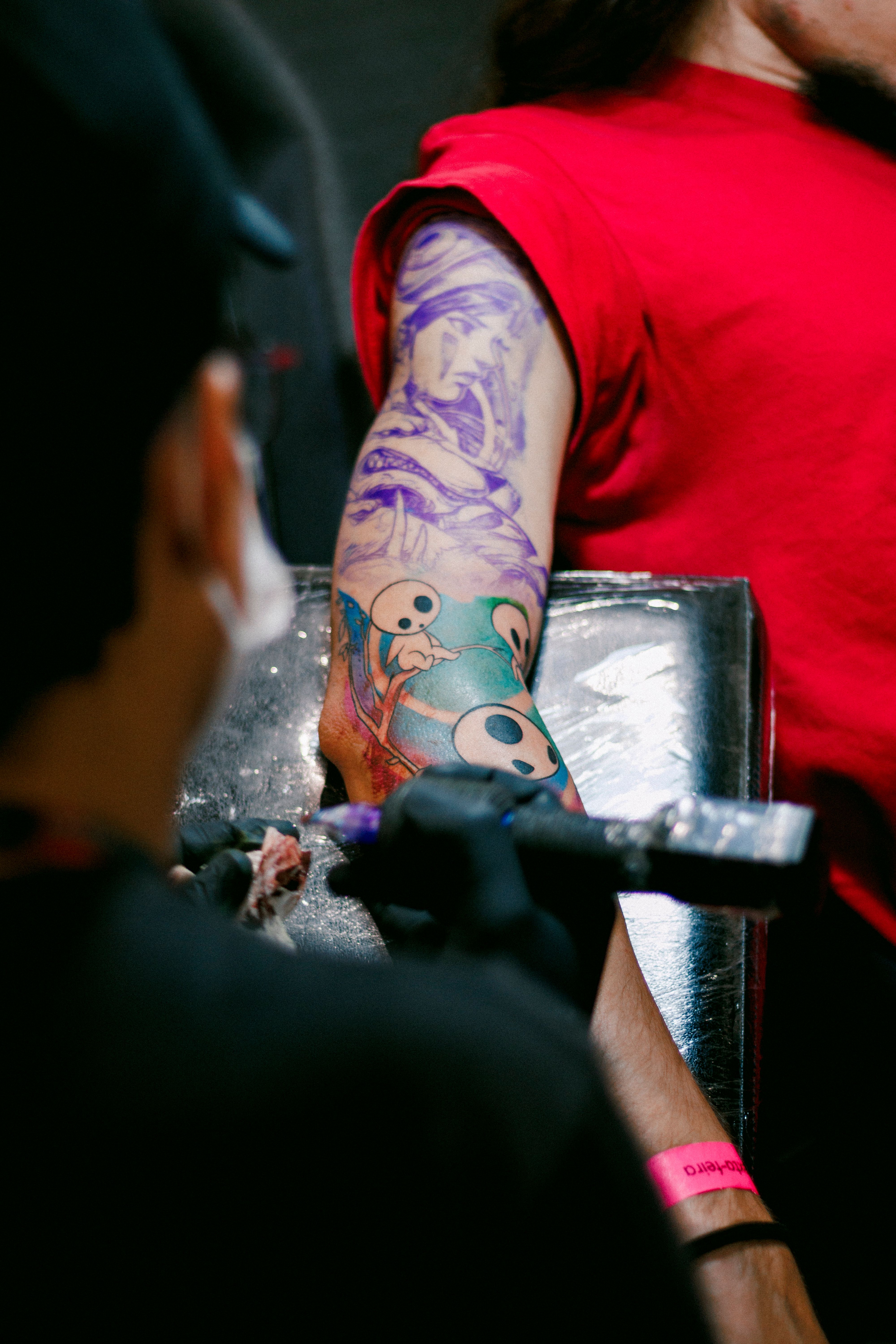Colorful Arm Tattoo in Progress by Tattoo Artist · Free Stock Photo