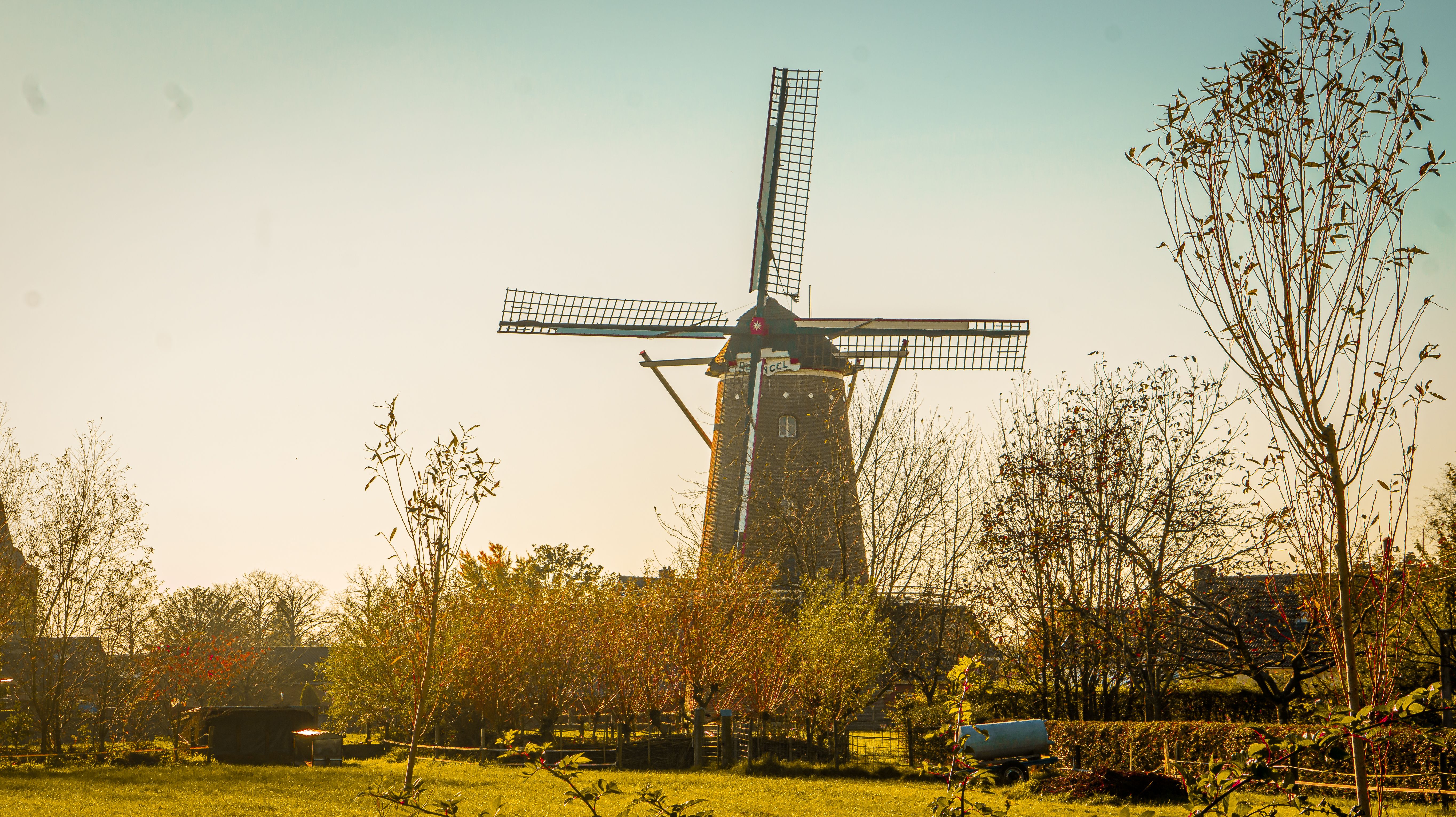 Charming Dutch Windmill in Autumn Landscape · Free Stock Photo
