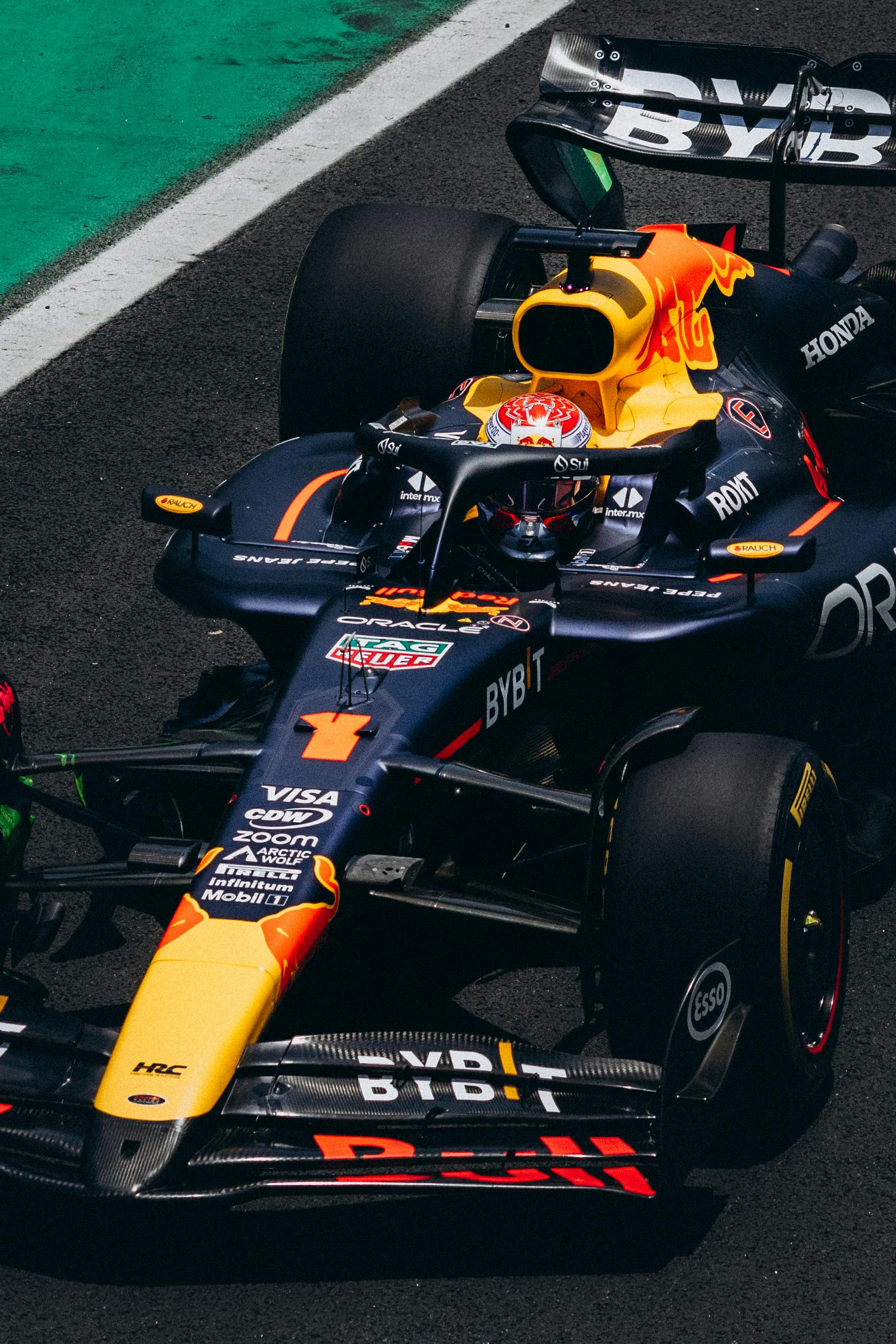 High-Speed Formula 1 Racing Action on Track · Free Stock Photo