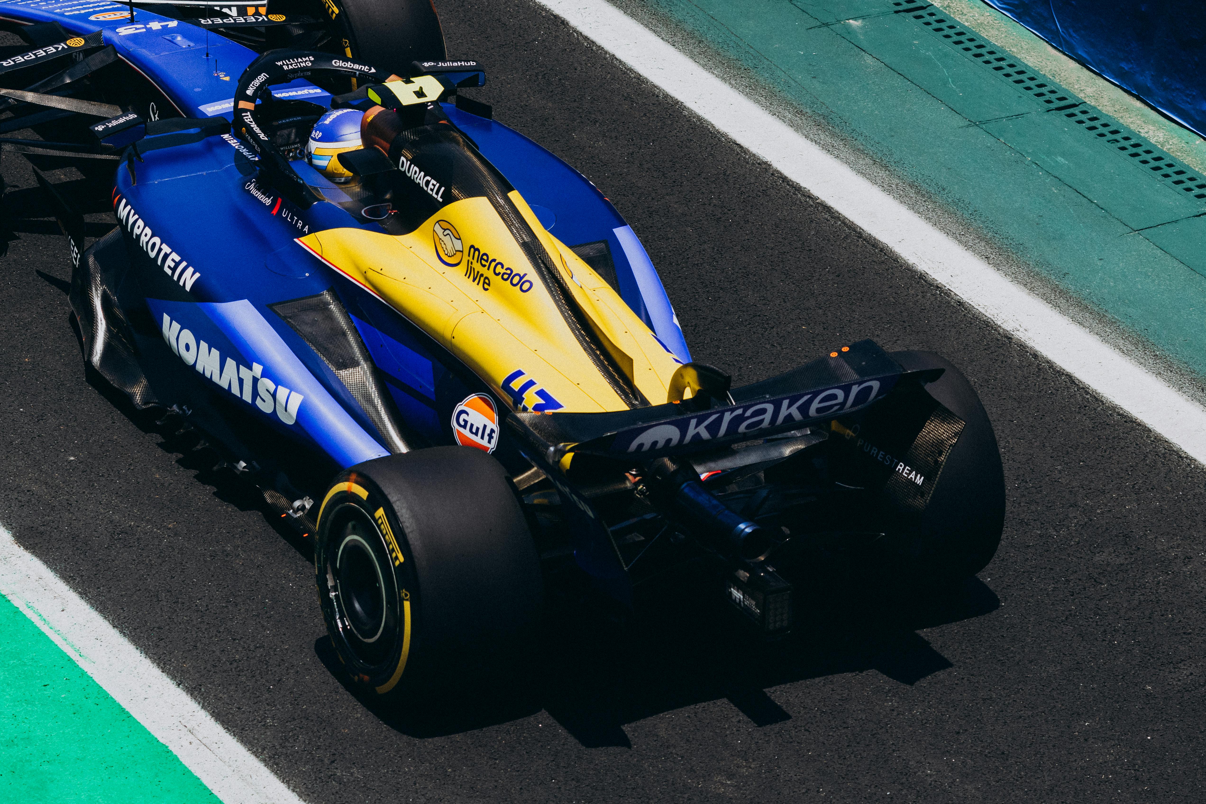 High-Speed Formula Race Car on Track · Free Stock Photo