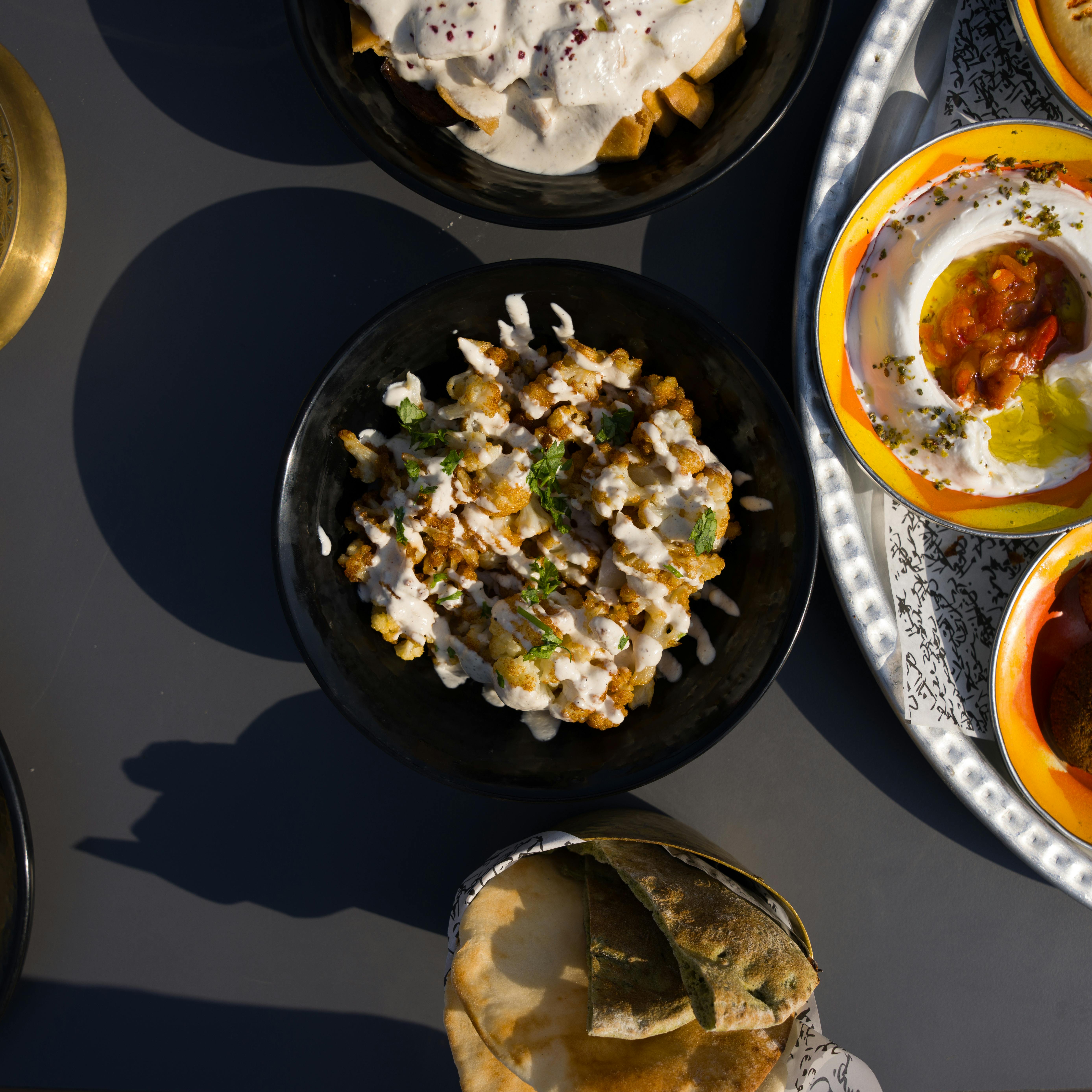Middle Eastern Mezze Platter with Various Dishes · Free Stock Photo