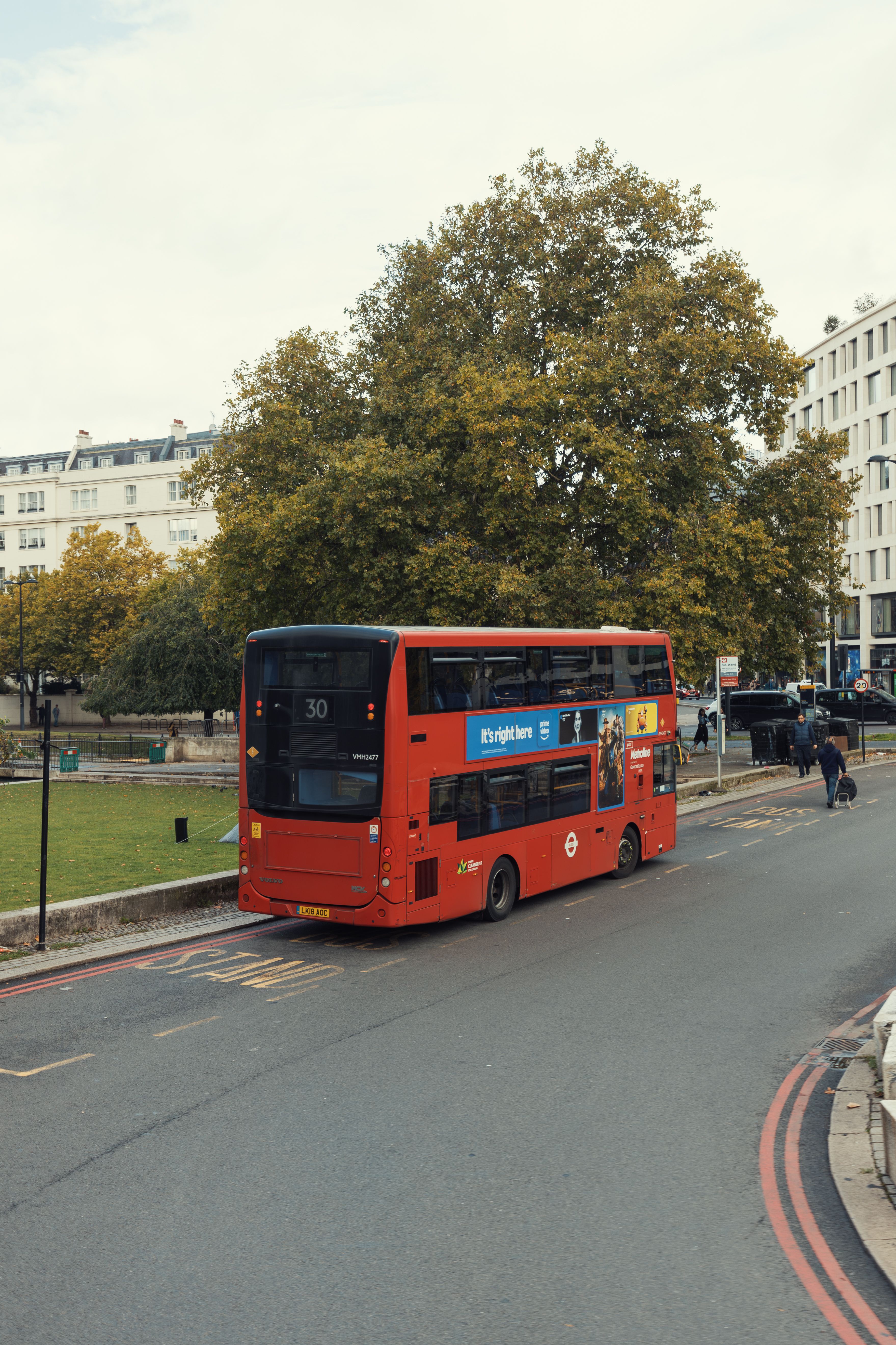 Iconic Red Double-Decker Bus in London Street · Free Stock Photo