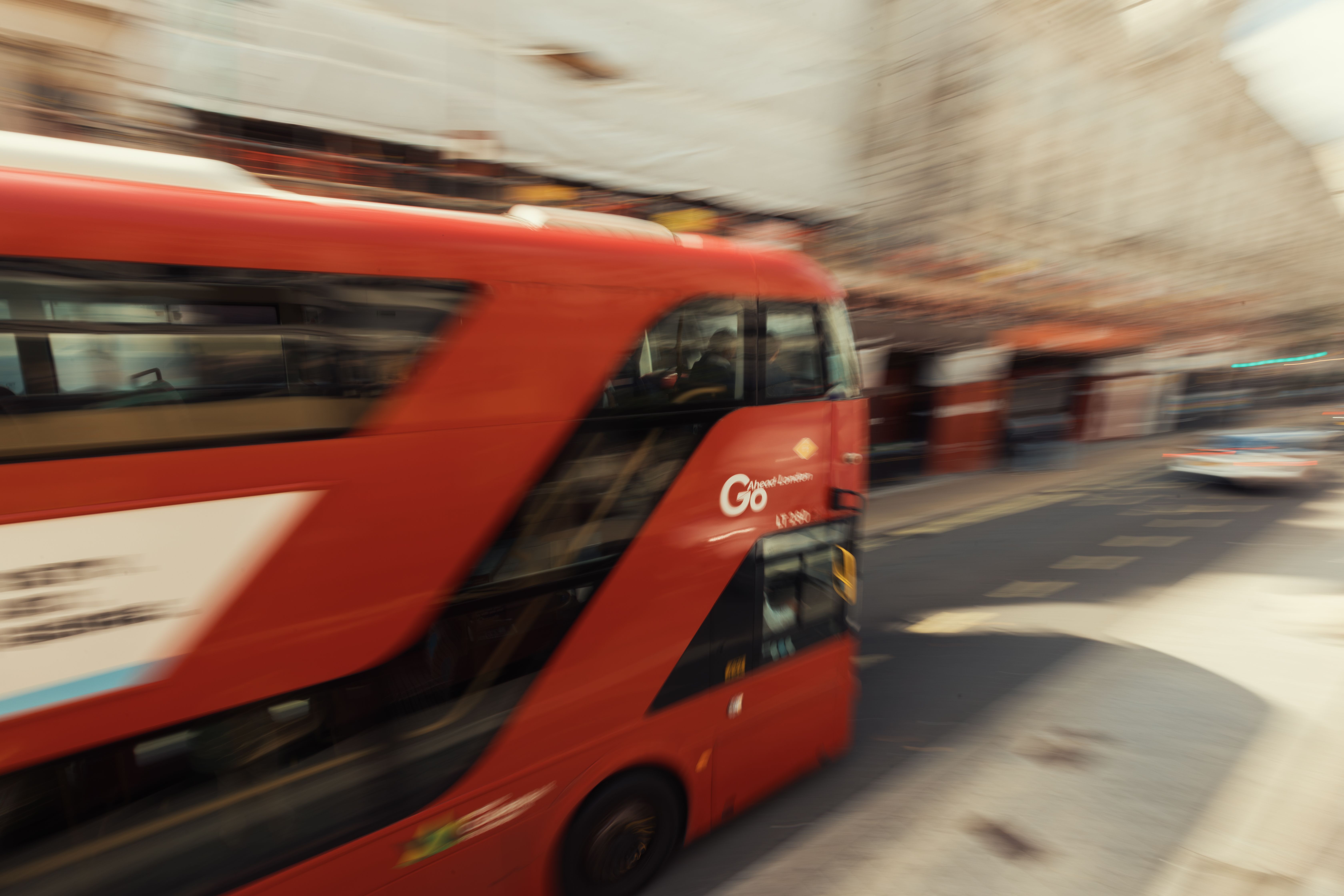 Dynamic Motion of Iconic London Red Bus on City Street · Free Stock Photo