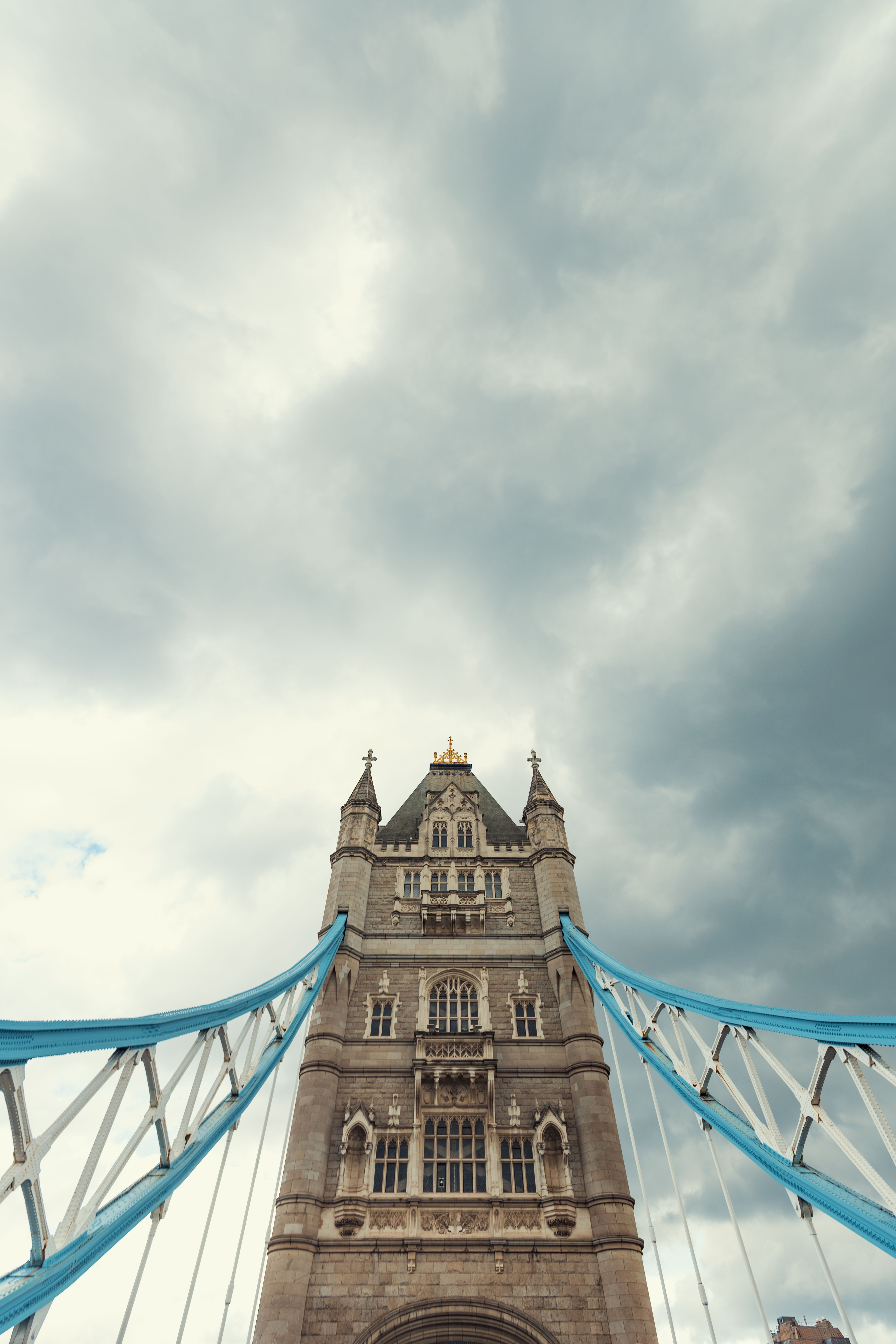 Iconic Tower Bridge Under Dramatic Skies · Free Stock Photo