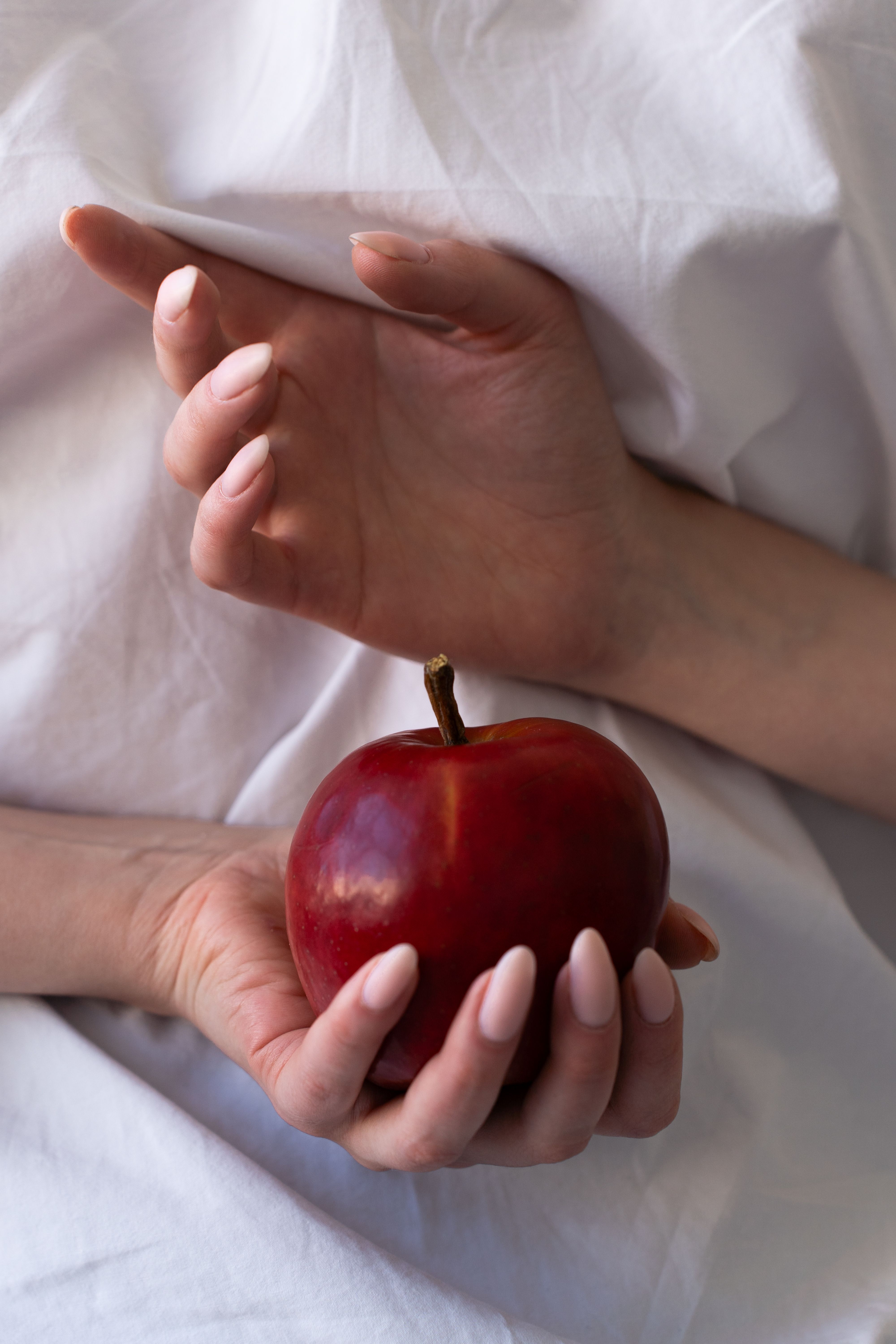 Close-up of Woman Holding Red Apple in Gentle Hands · Free Stock Photo