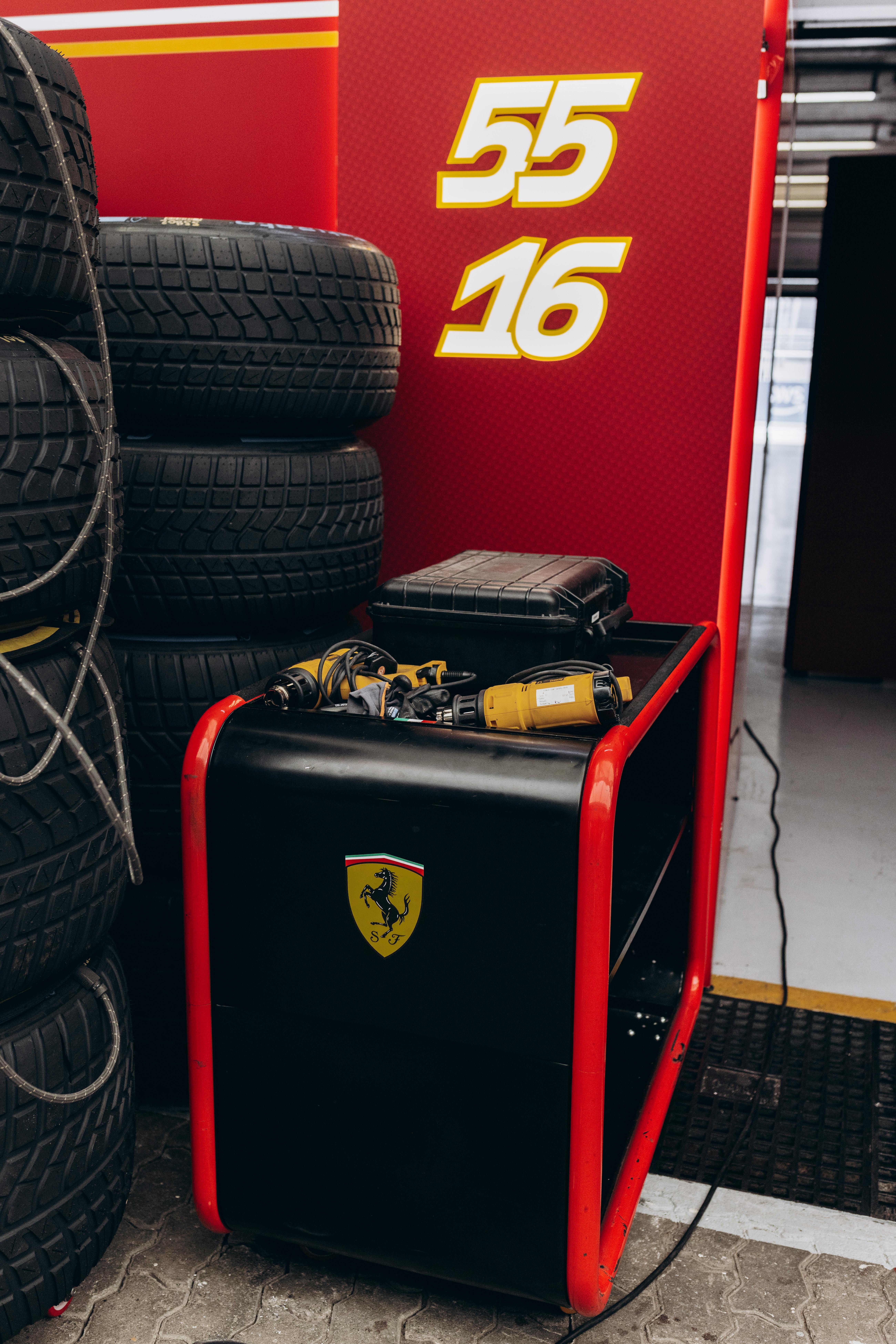 Formula 1 Red Pit Garage Tire Setup · Free Stock Photo
