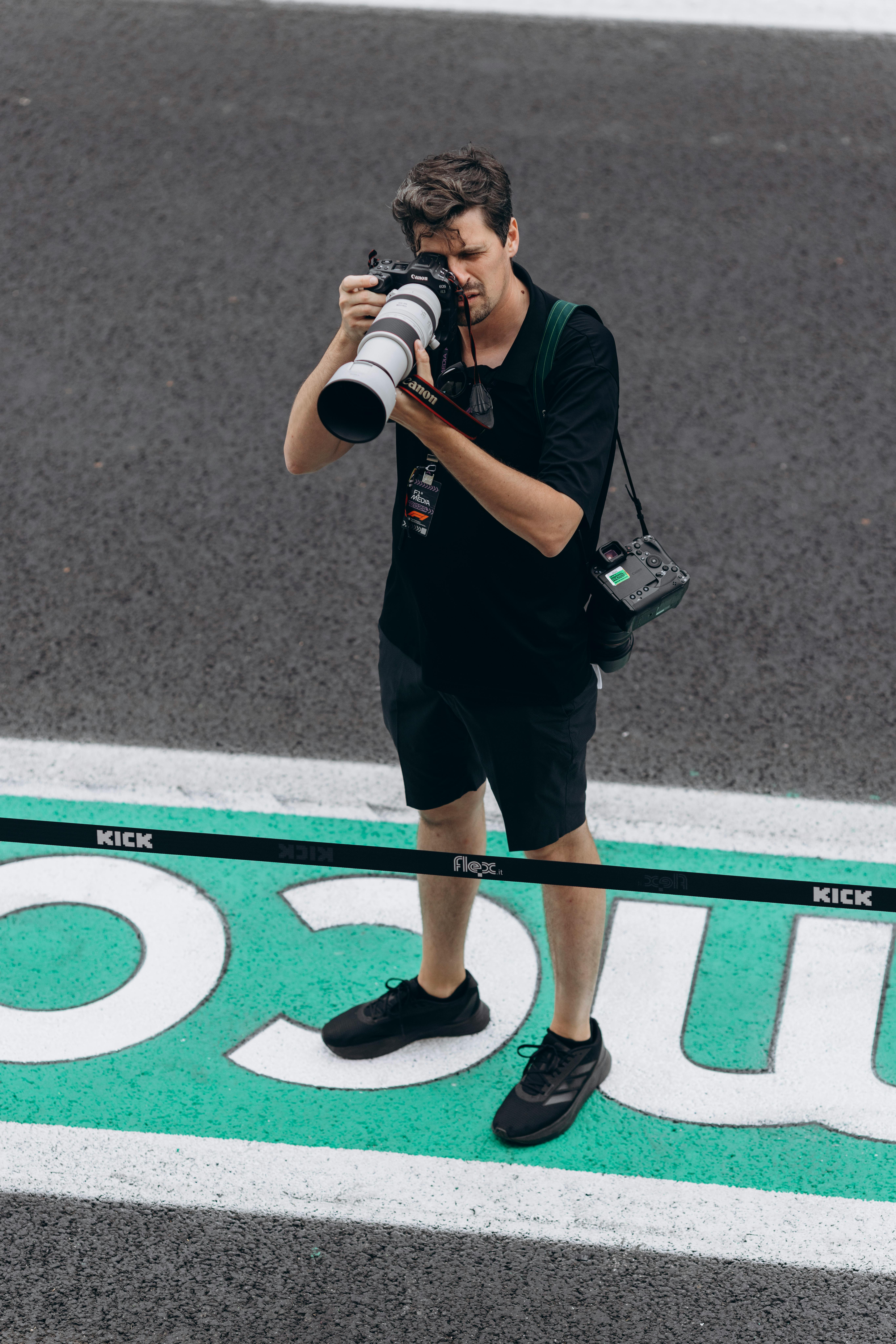 Sports Photographer at Racing Event · Free Stock Photo