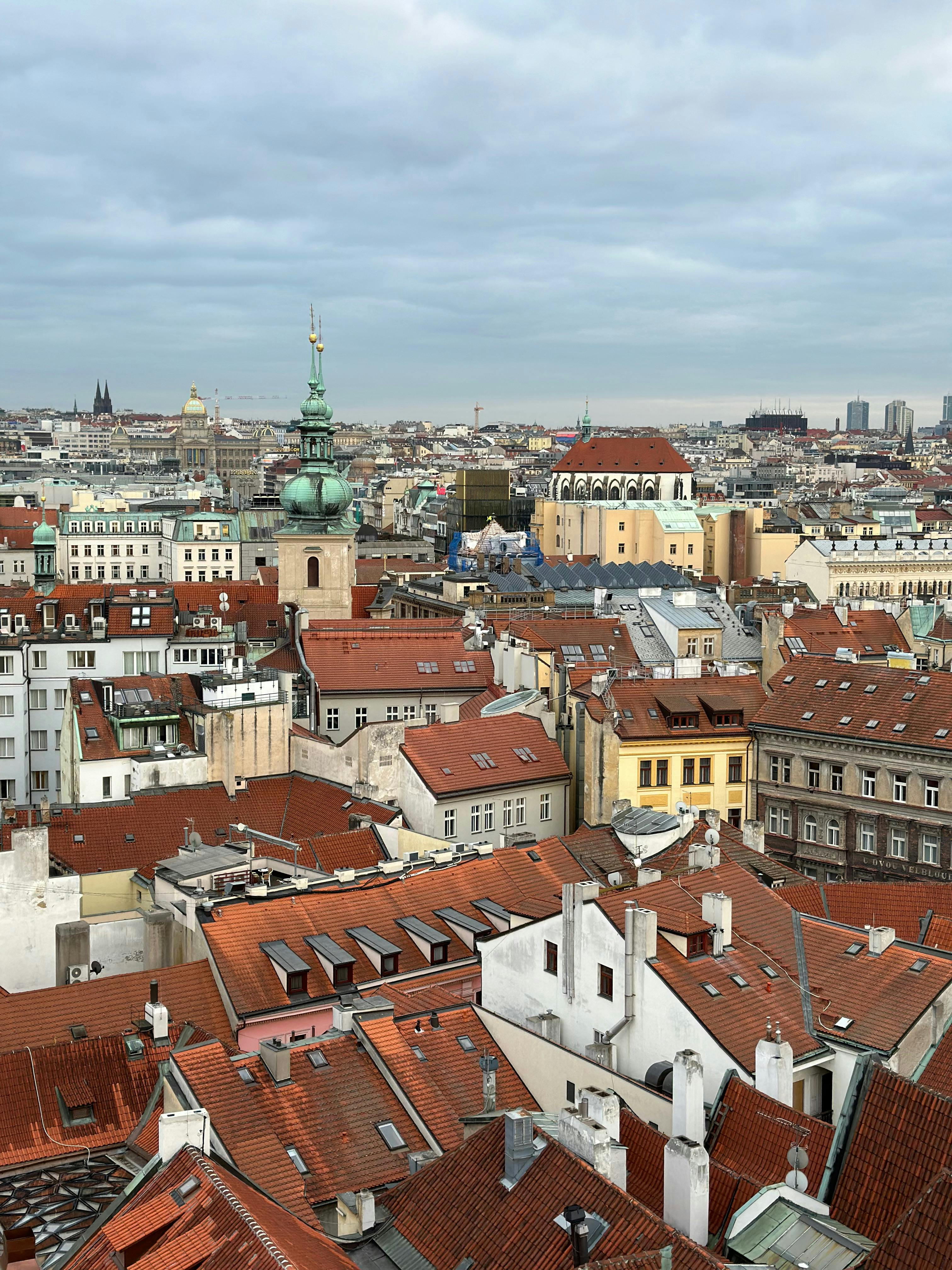 Panoramic View of Prague's Historic Rooftops · Free Stock Photo