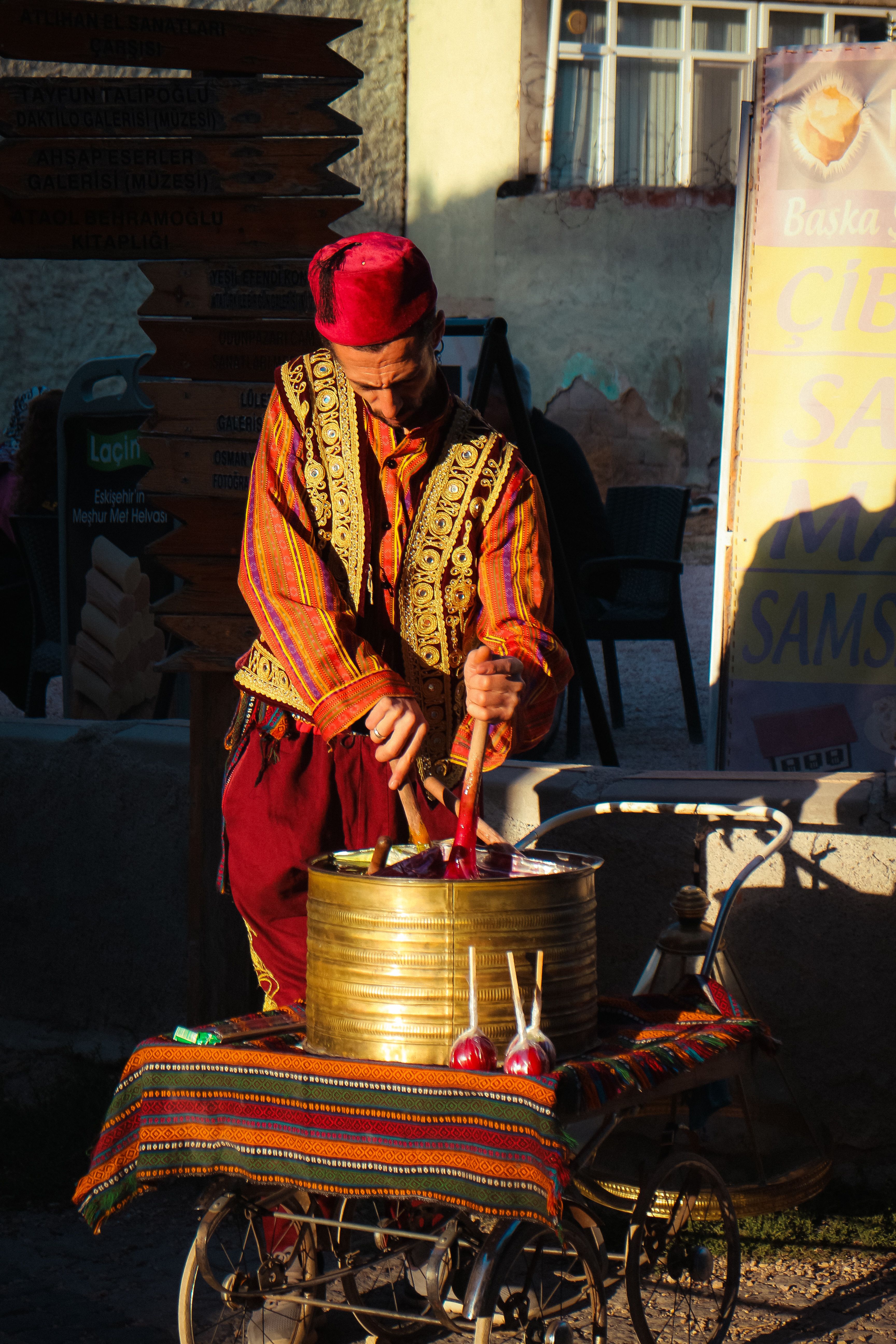 Traditional Turkish Street Vendor in Vibrant Attire · Free Stock Photo