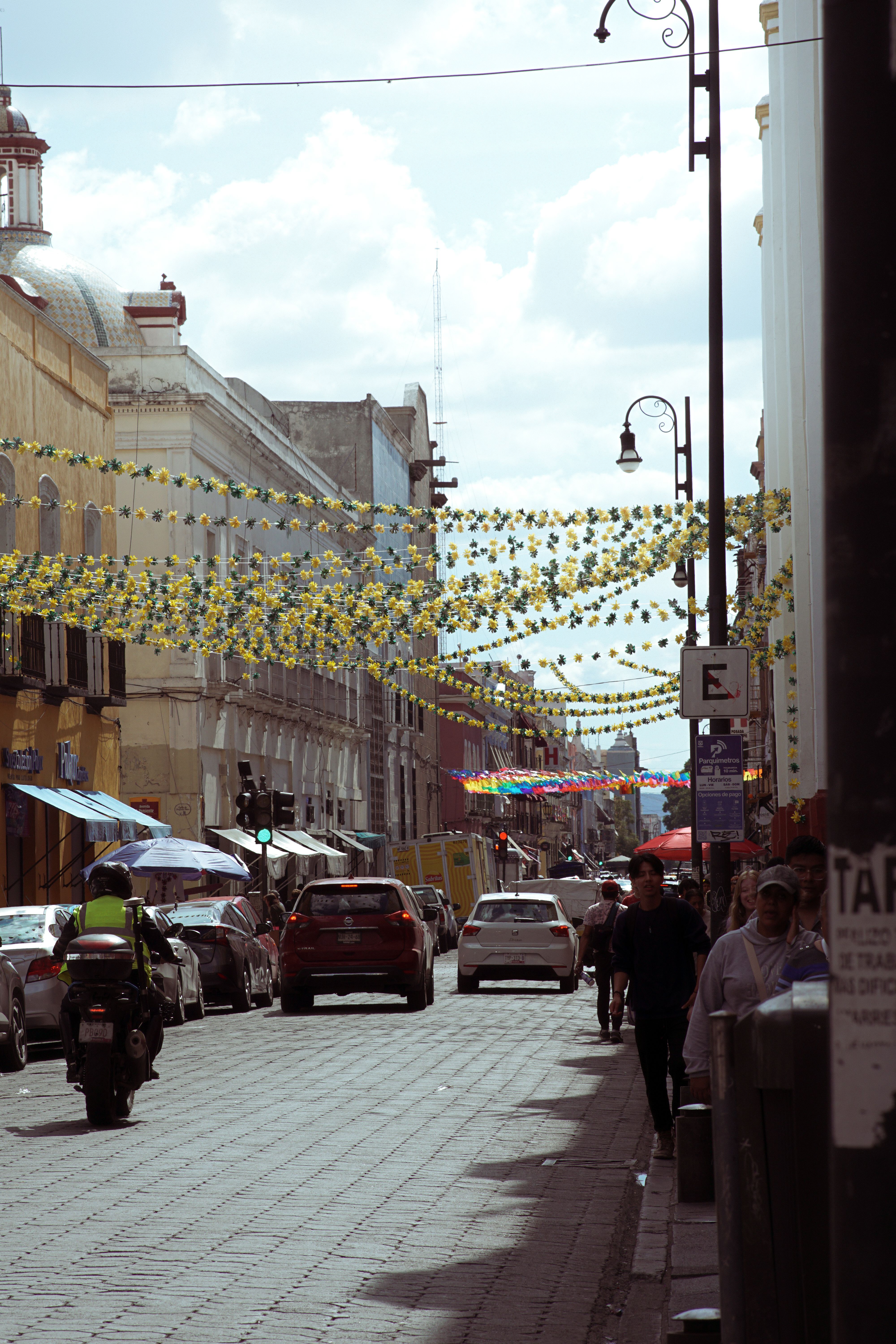 Vibrant Street with Festive Decorations in Daylight · Free Stock Photo