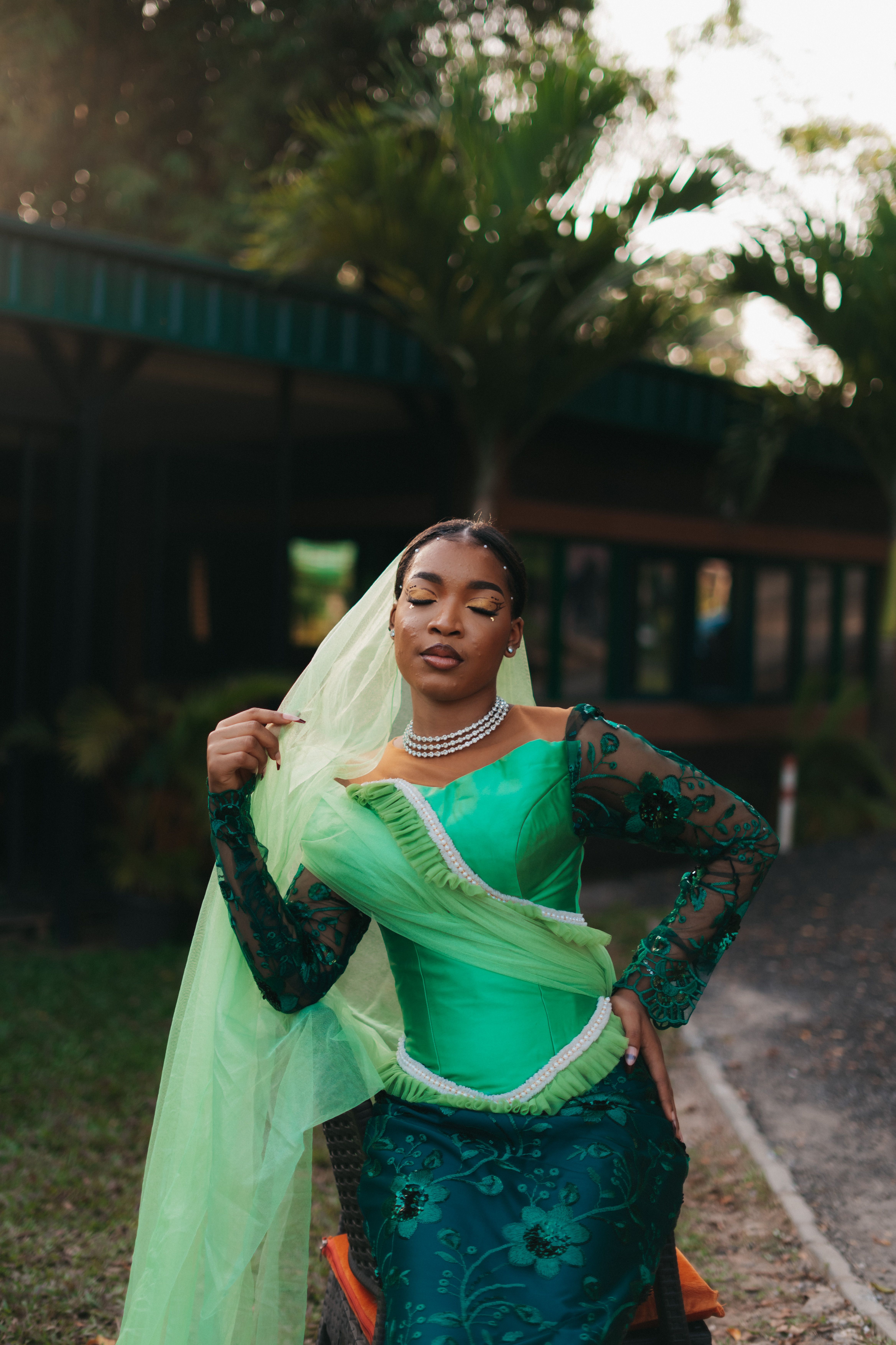 Elegant Bride in Green Traditional Dress · Free Stock Photo