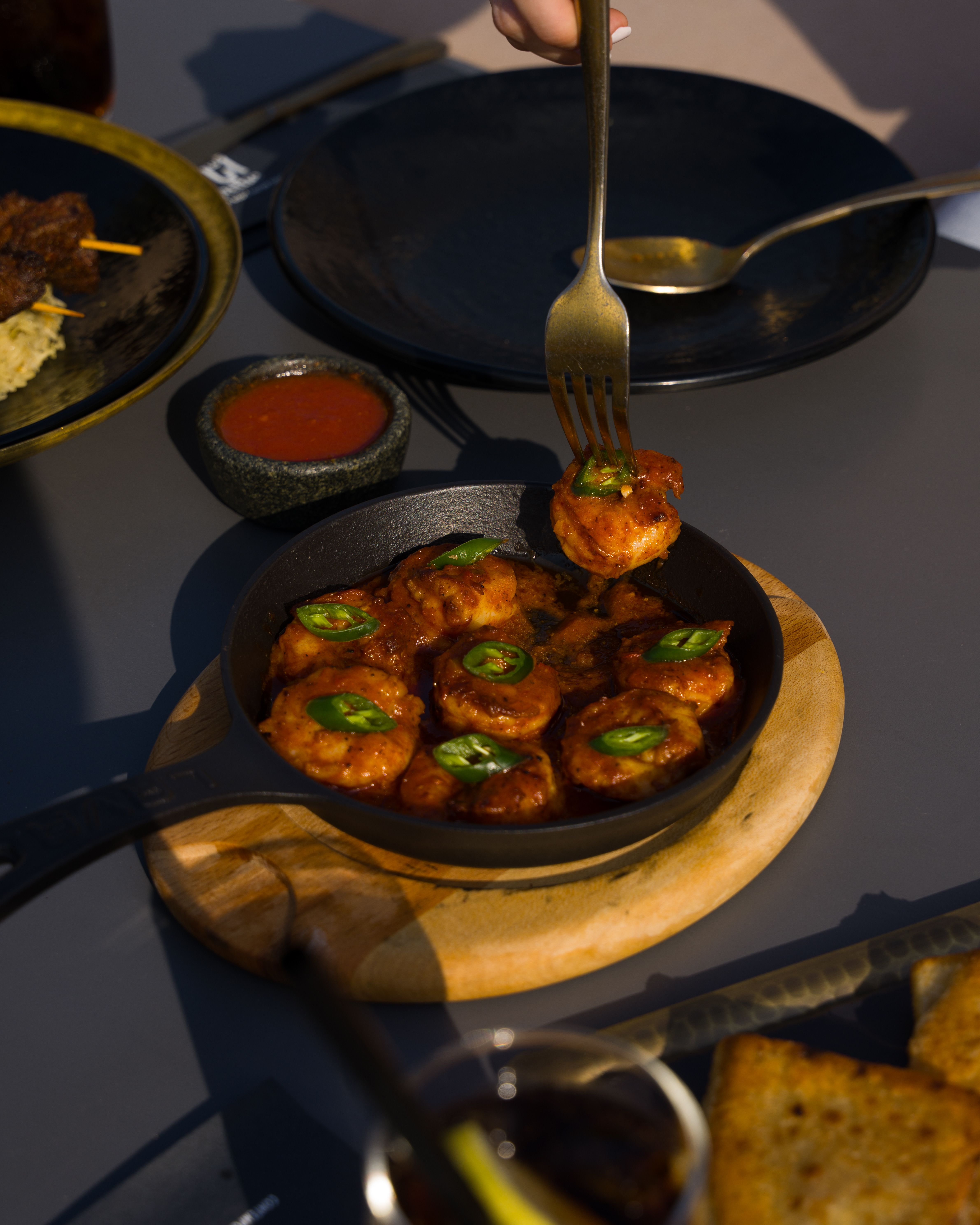 Spicy Fried Dish with Green Peppers on Table · Free Stock Photo