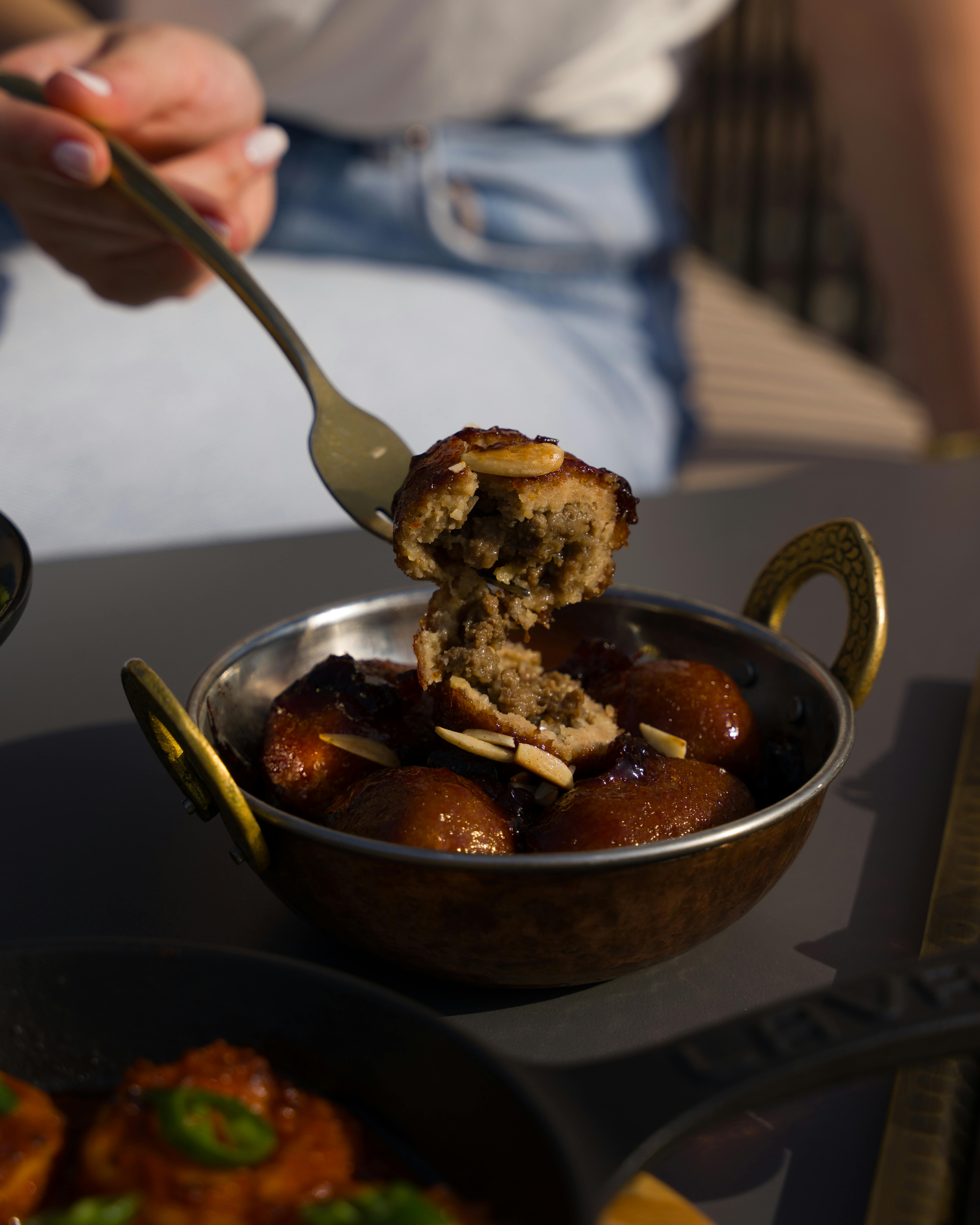 Close-up of Gulab Jamun on Fork in Indian Restaurant · Free Stock Photo