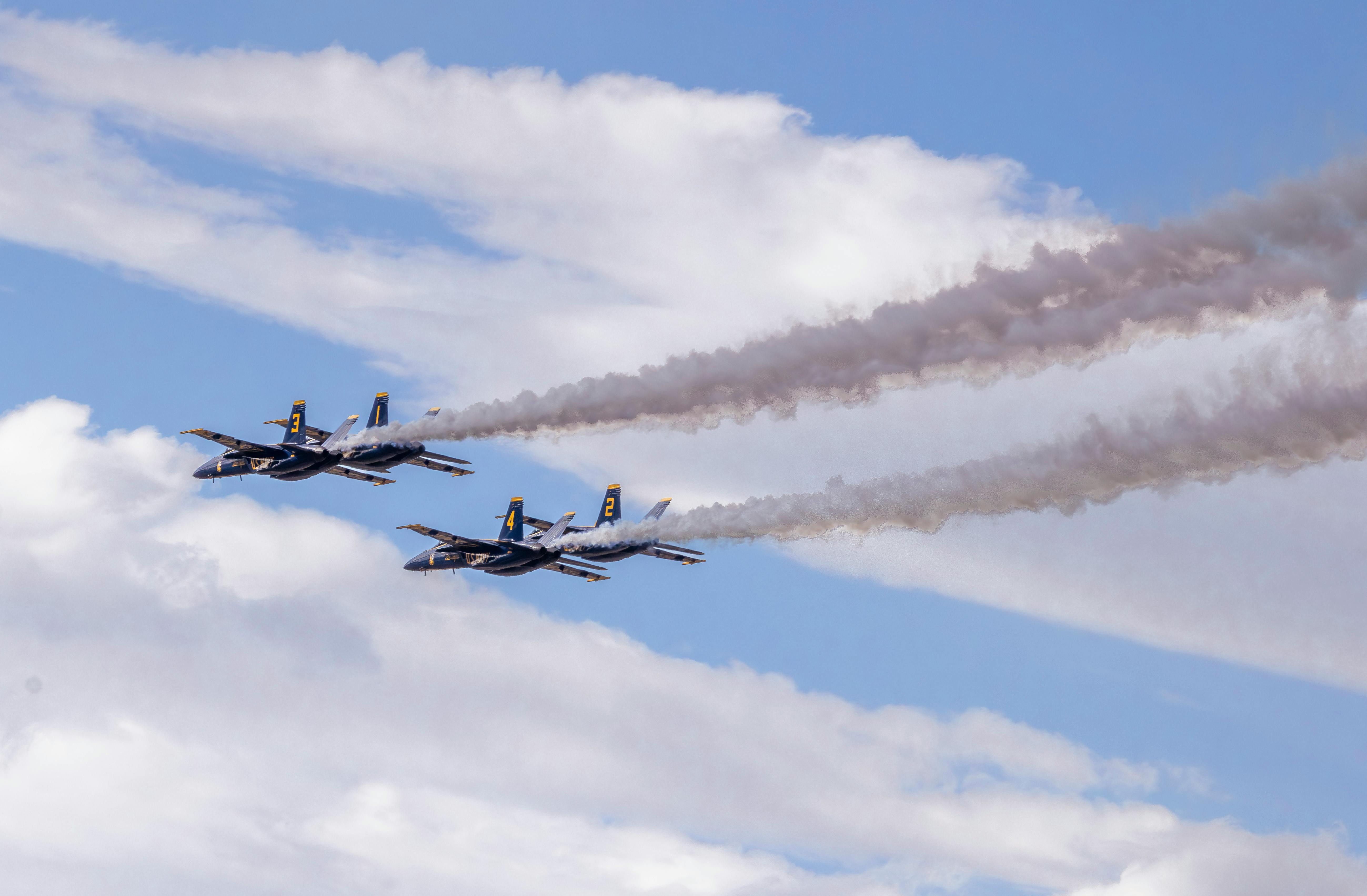 Aerial Stunt Planes Performing in Blue Sky · Free Stock Photo