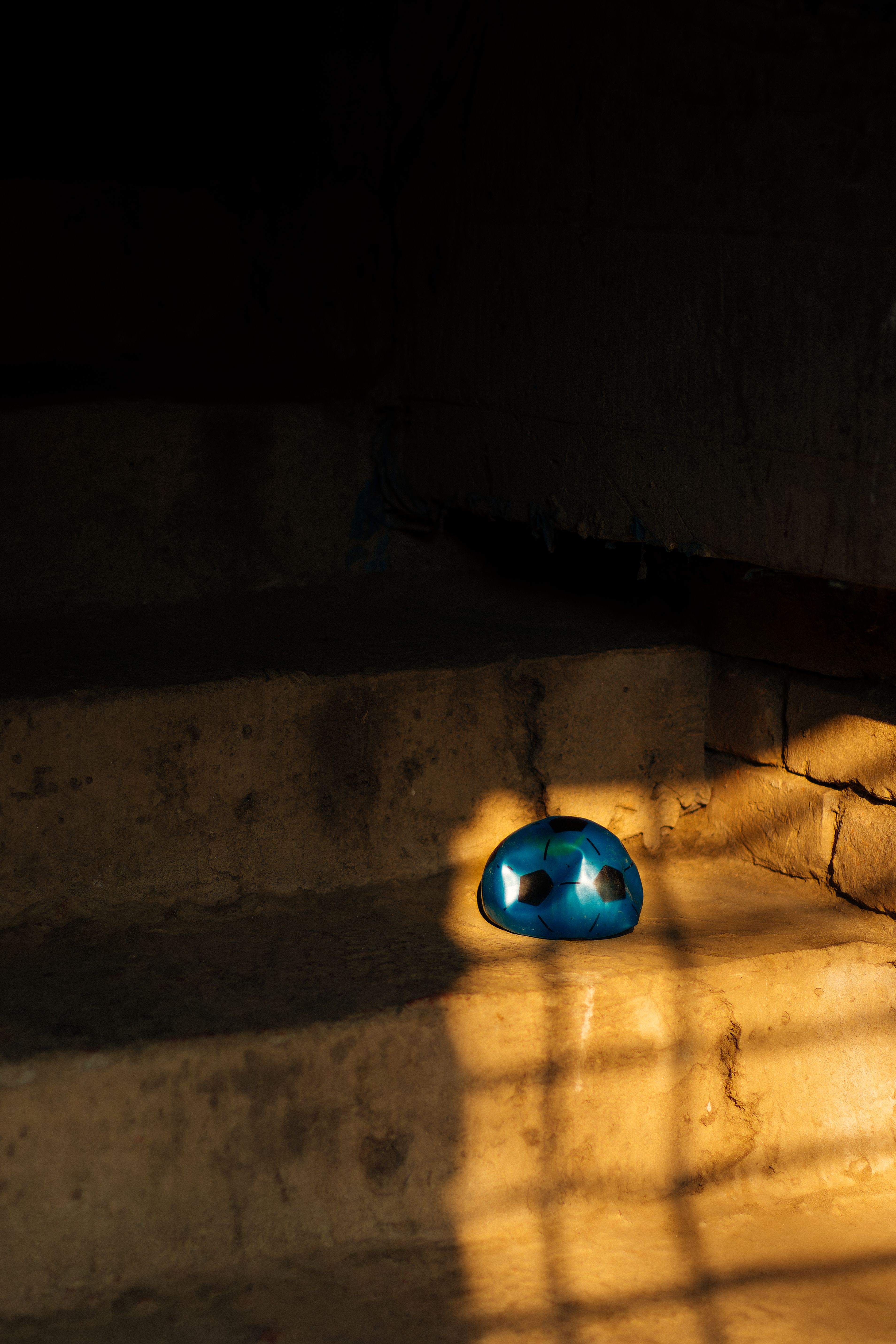 Deflated Soccer Ball on Stairs During Sunset · Free Stock Photo