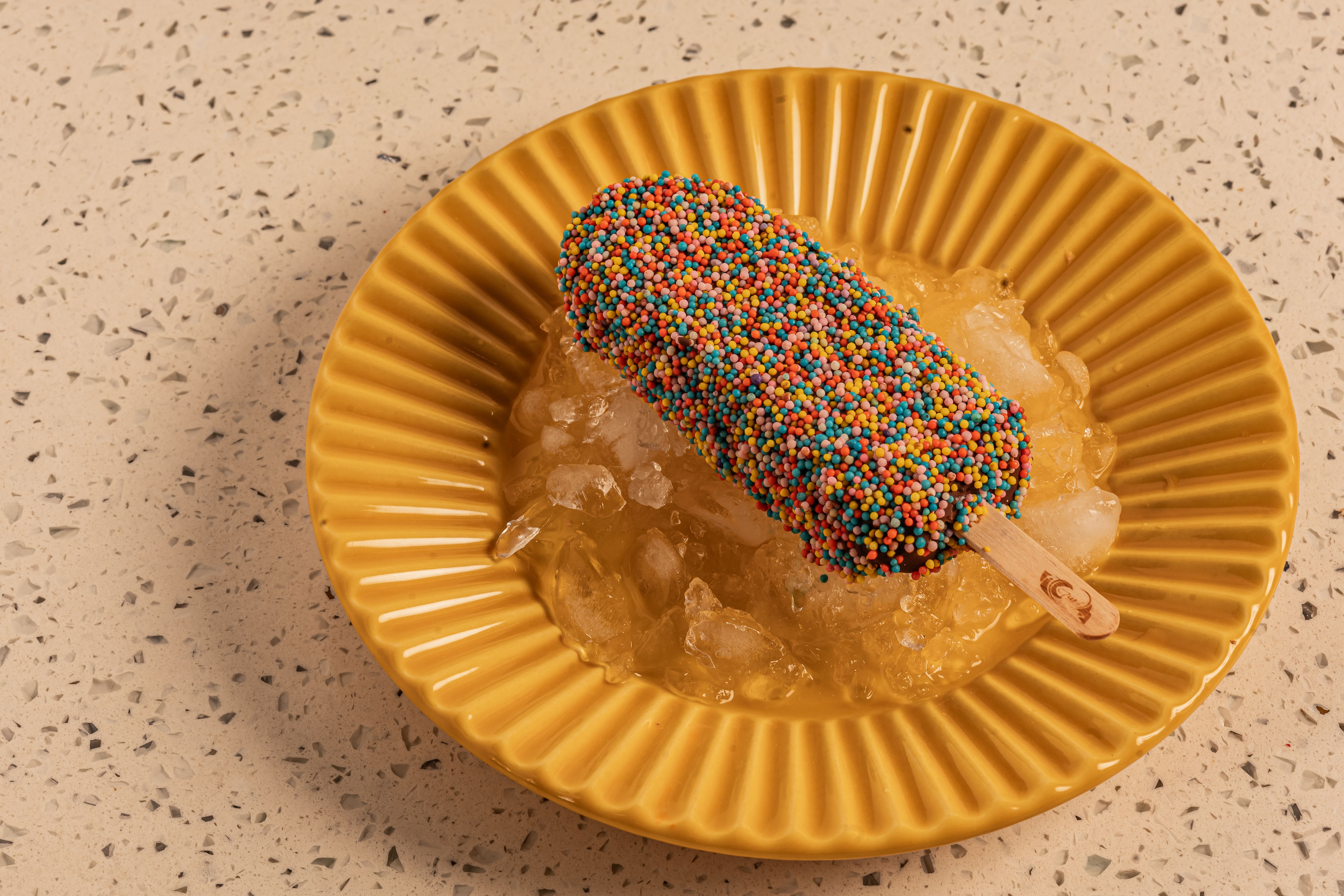 Colorful Ice Cream Bar on Vibrant Plate · Free Stock Photo