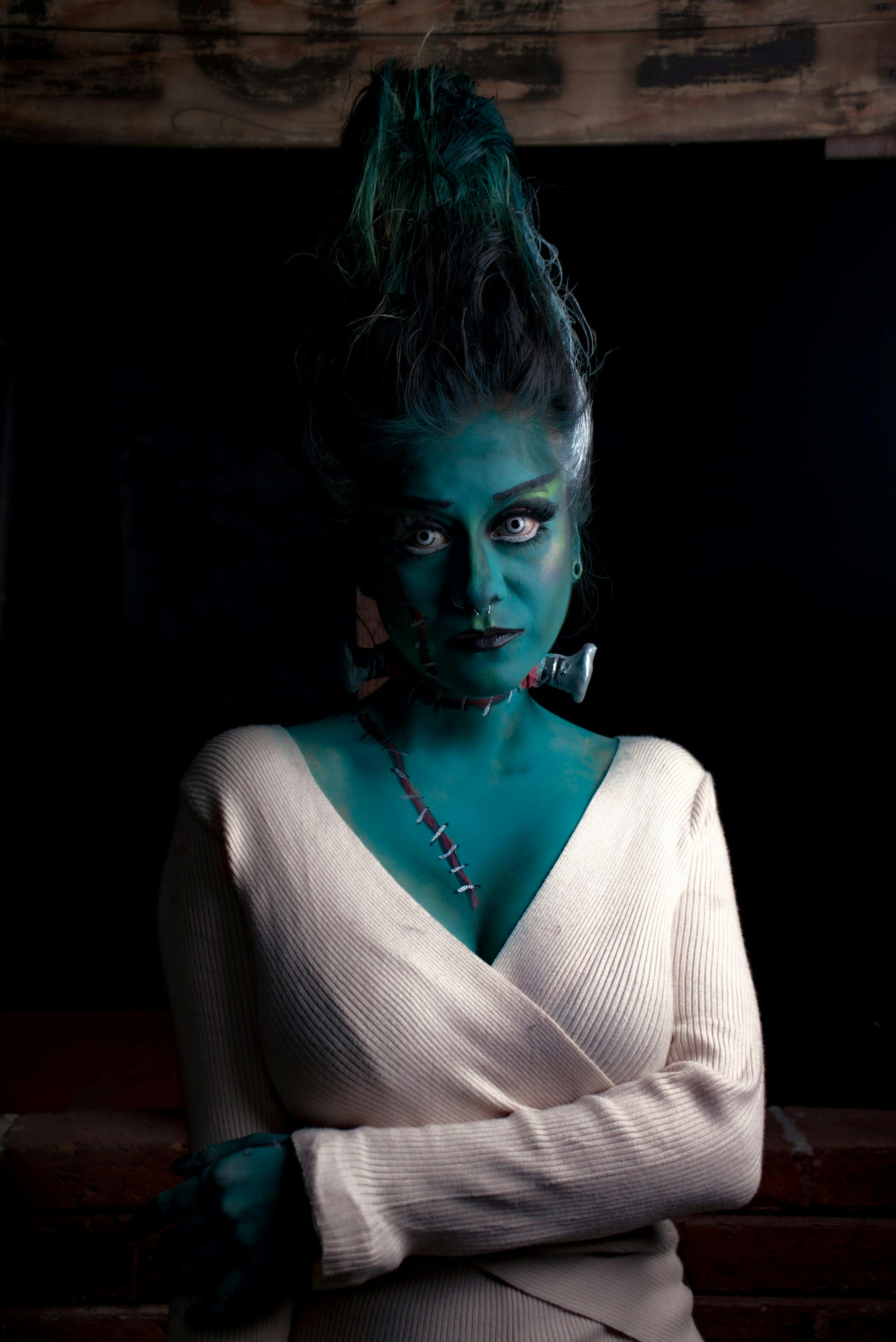 Eerie Blue-Skinned Woman in Gothic Makeup · Free Stock Photo