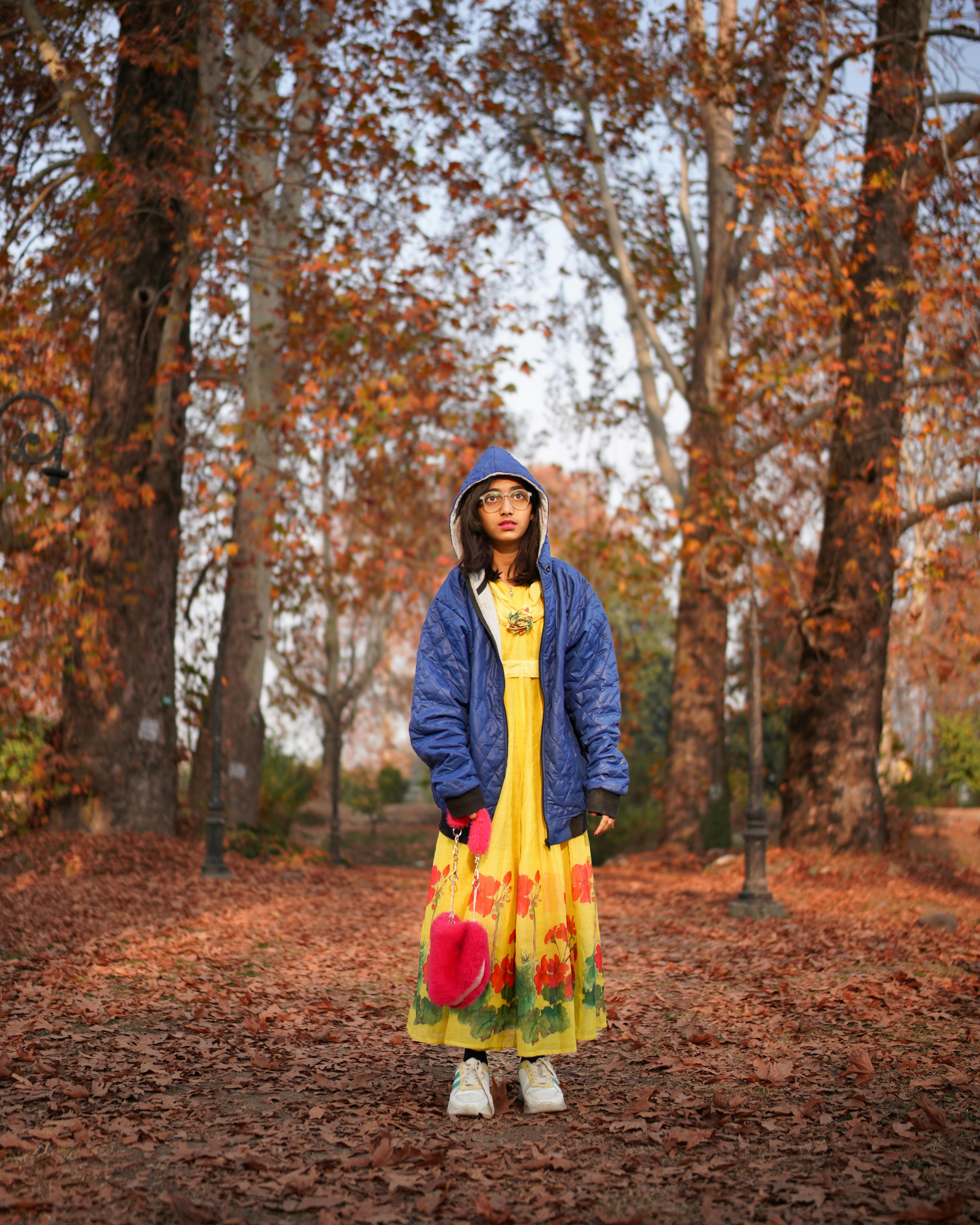 Autumn Fashion in a Vibrant Forest Setting · Free Stock Photo