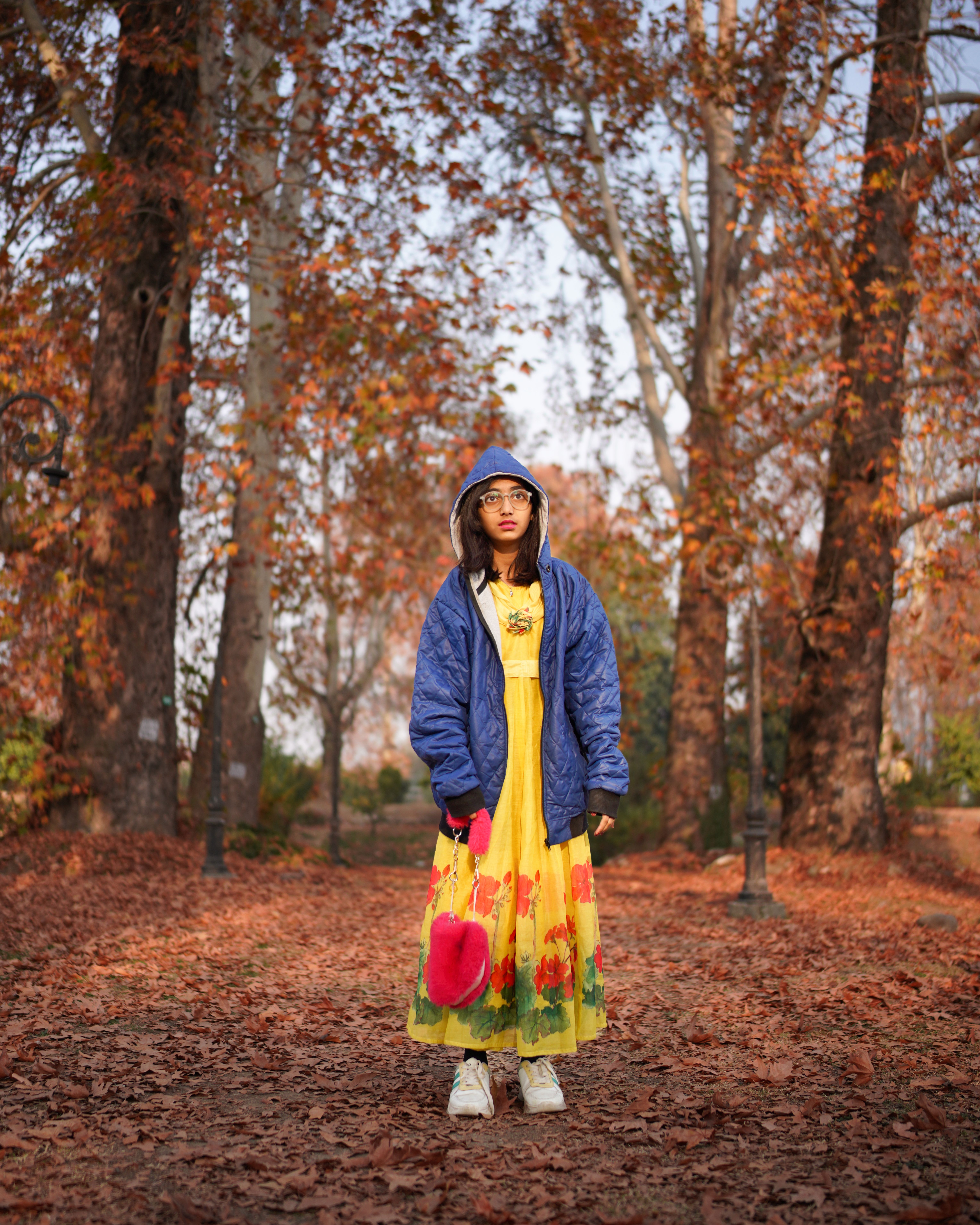 Autumn Fashion in a Vibrant Forest Setting · Free Stock Photo