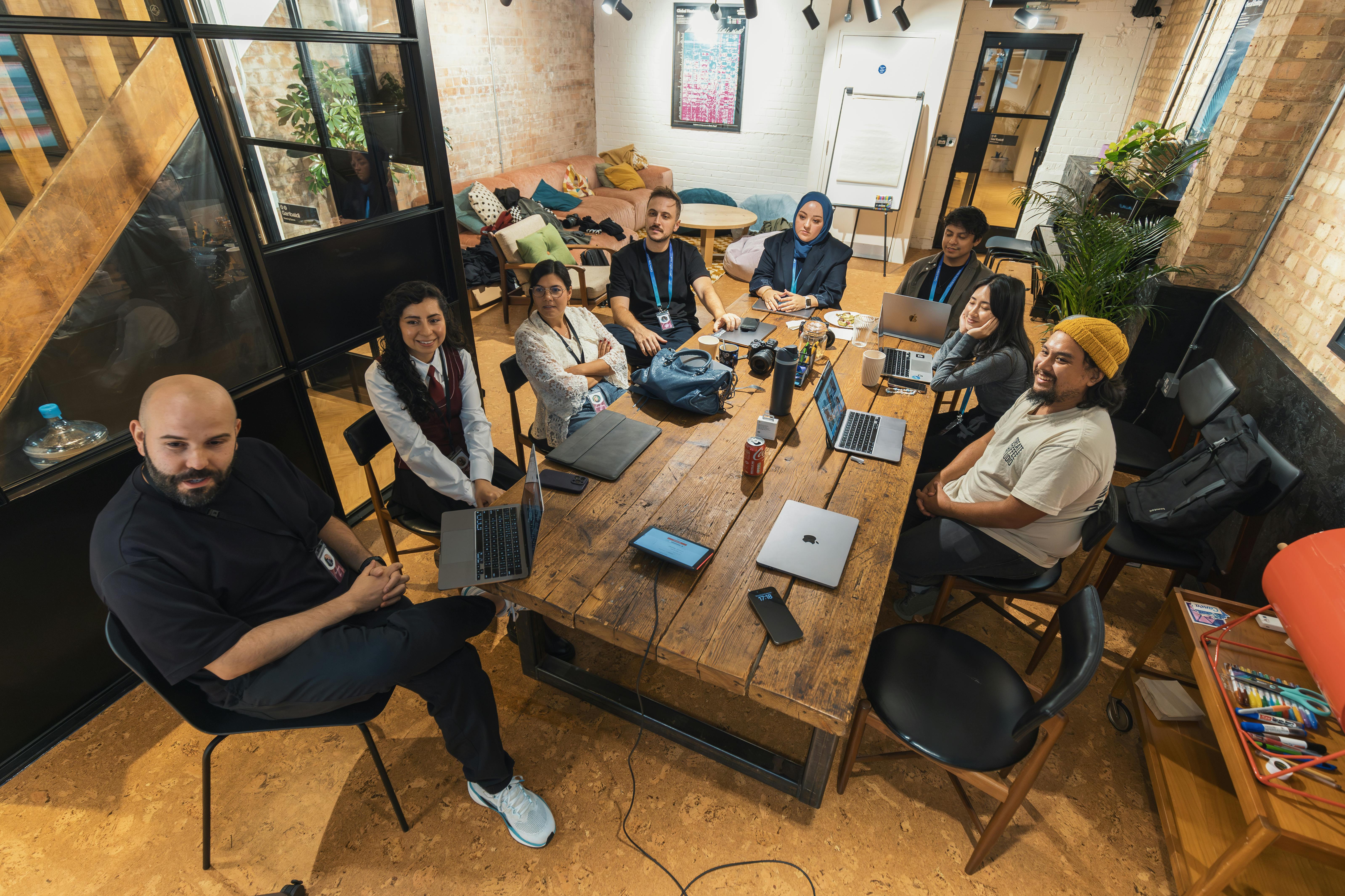 Diverse Team Meeting in Modern Office Space · Free Stock Photo
