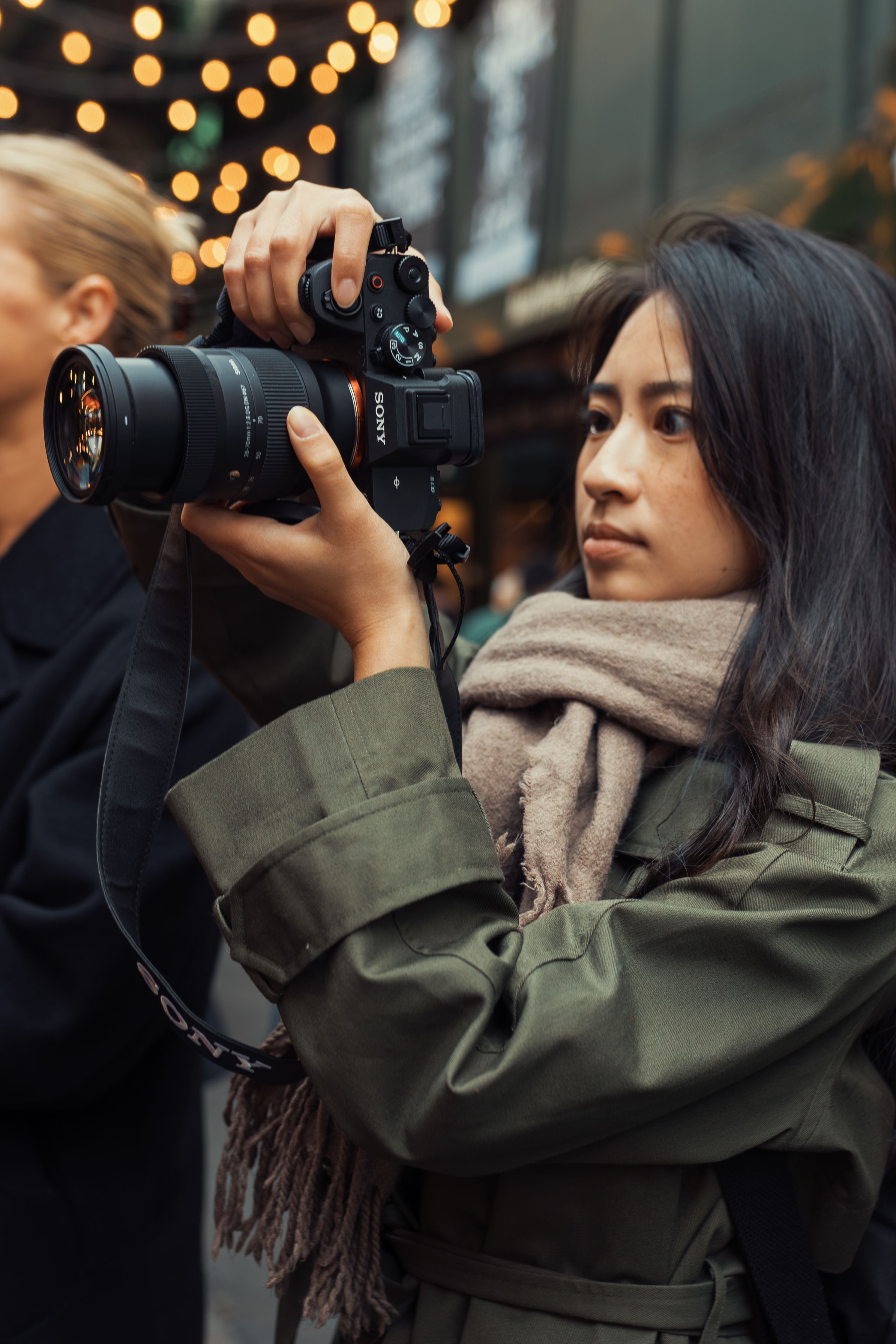 Young Photographer Captures Street Scene Outdoors · Free Stock Photo