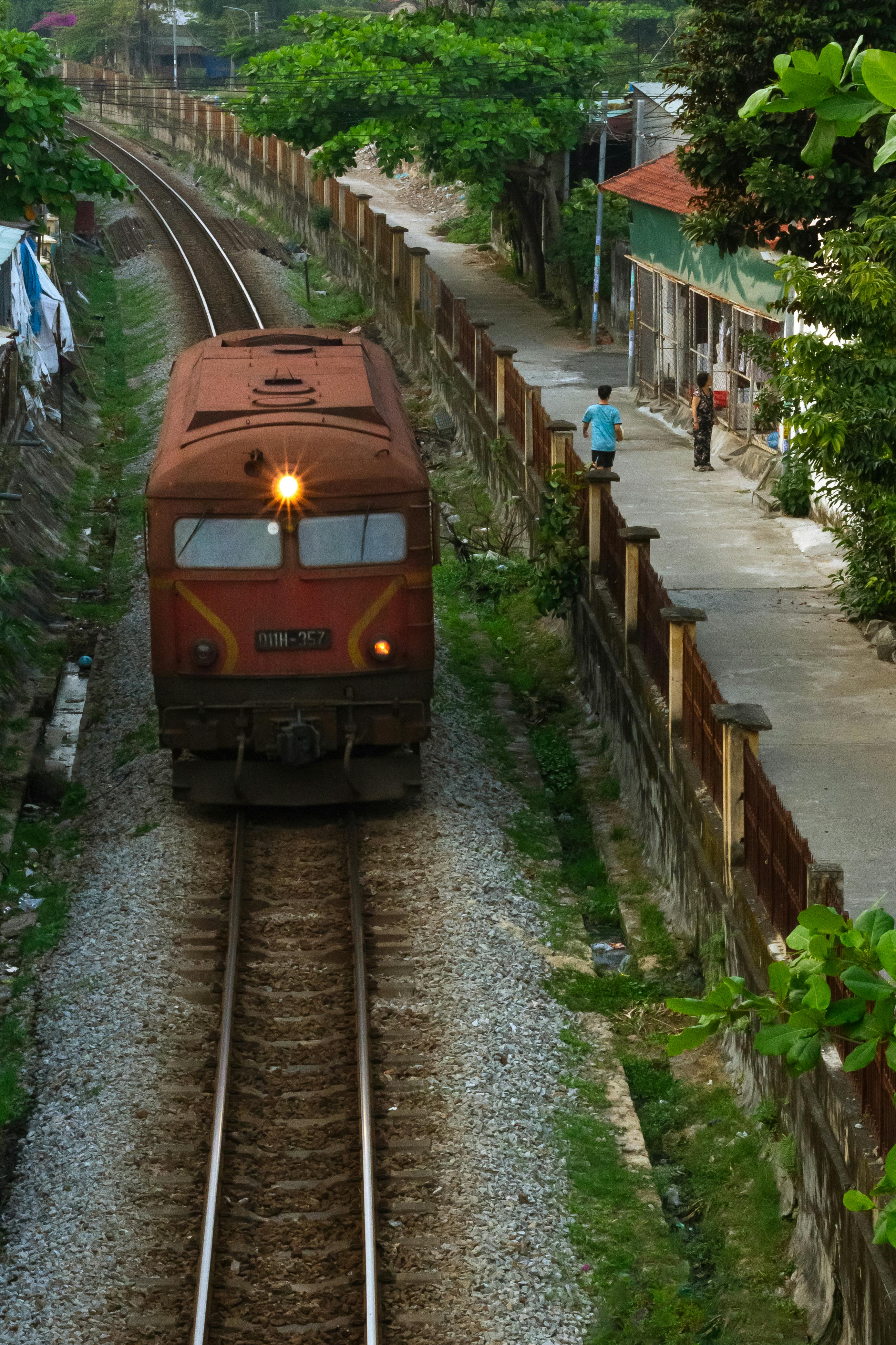 Vintage Red Train on Rustic Railroad Track · Free Stock Photo