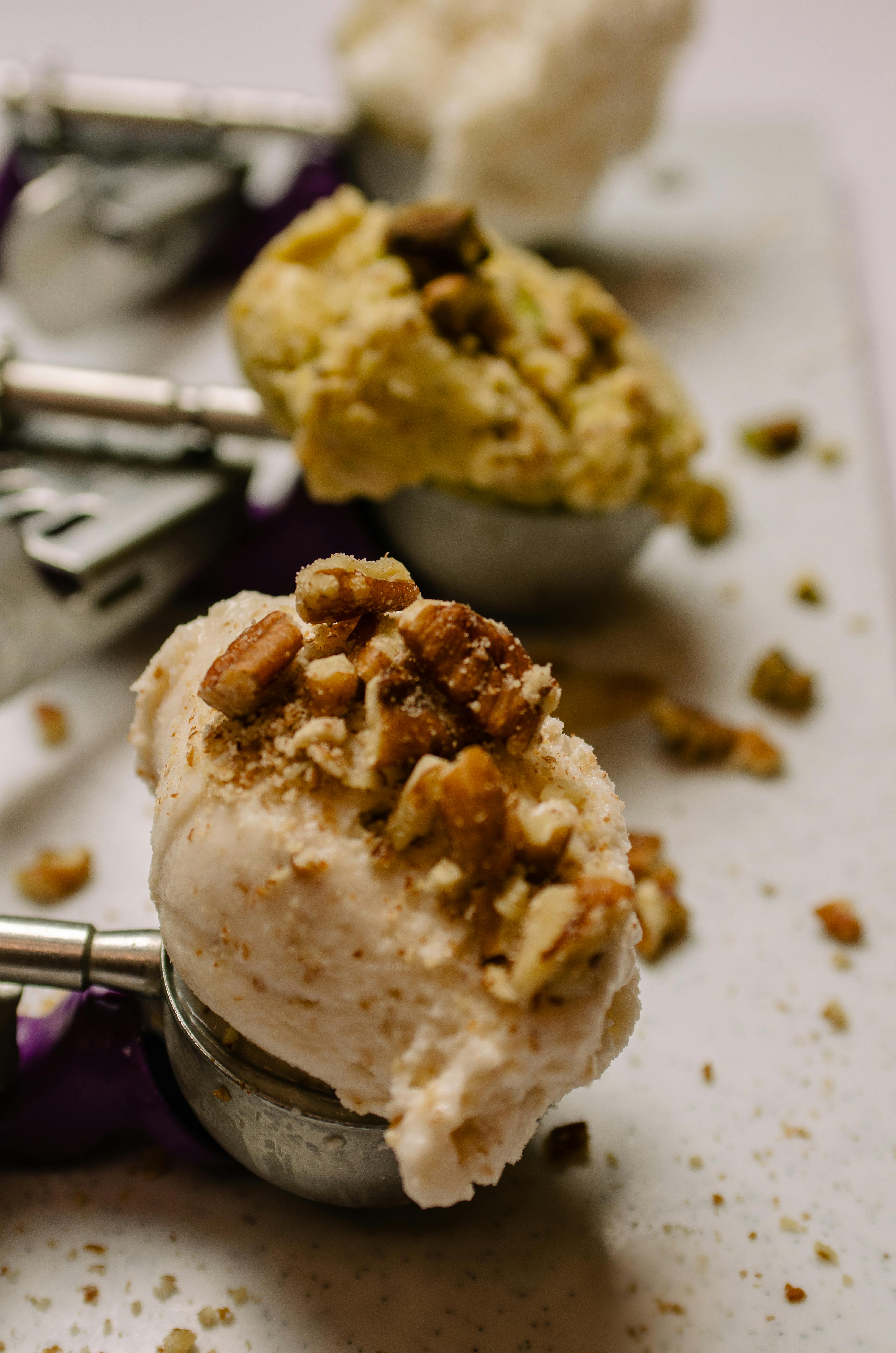 Delicious Ice Cream Scopes with Nuts Topping · Free Stock Photo
