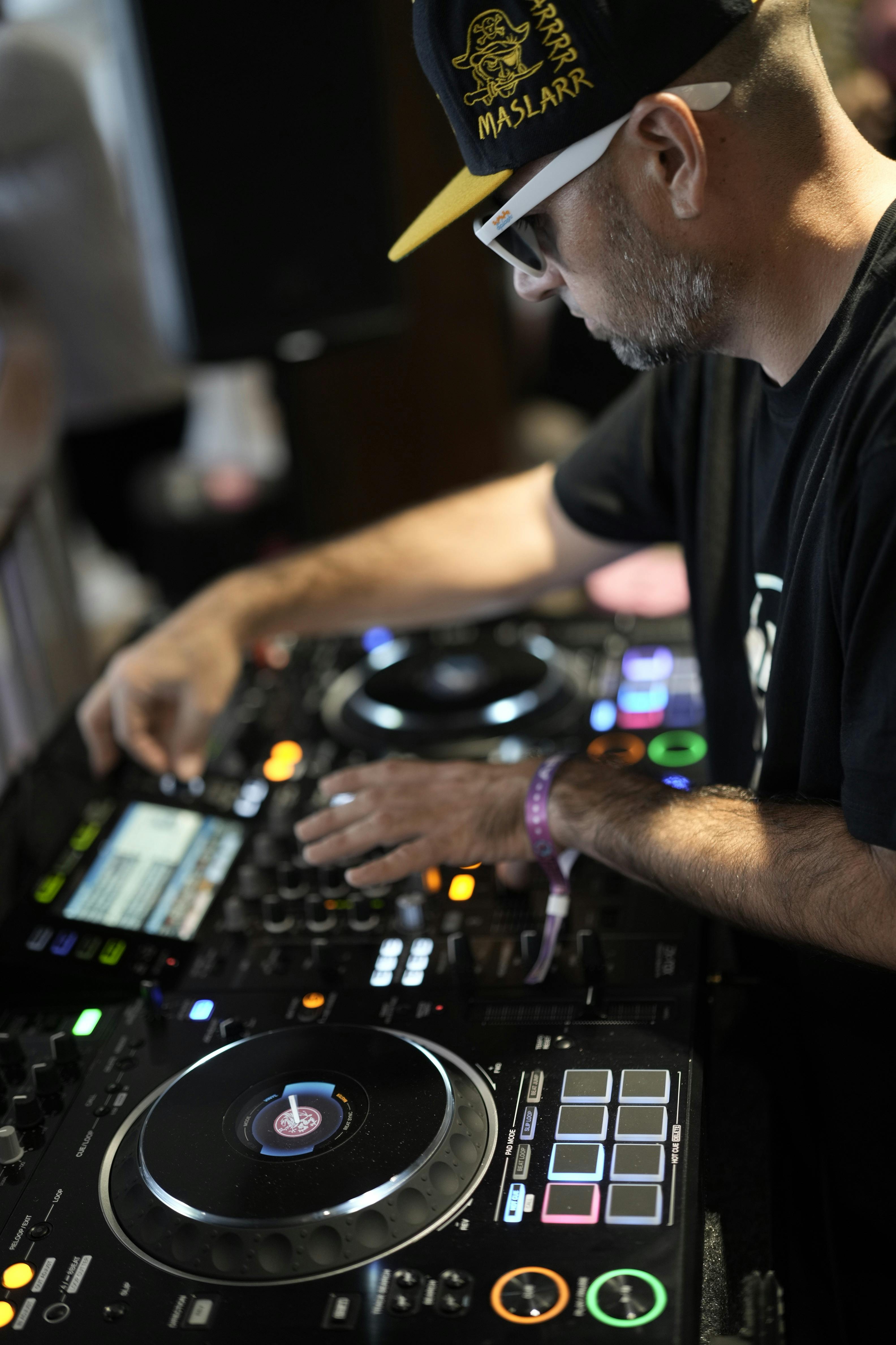 DJ Performing Live in Miami Nightclub · Free Stock Photo