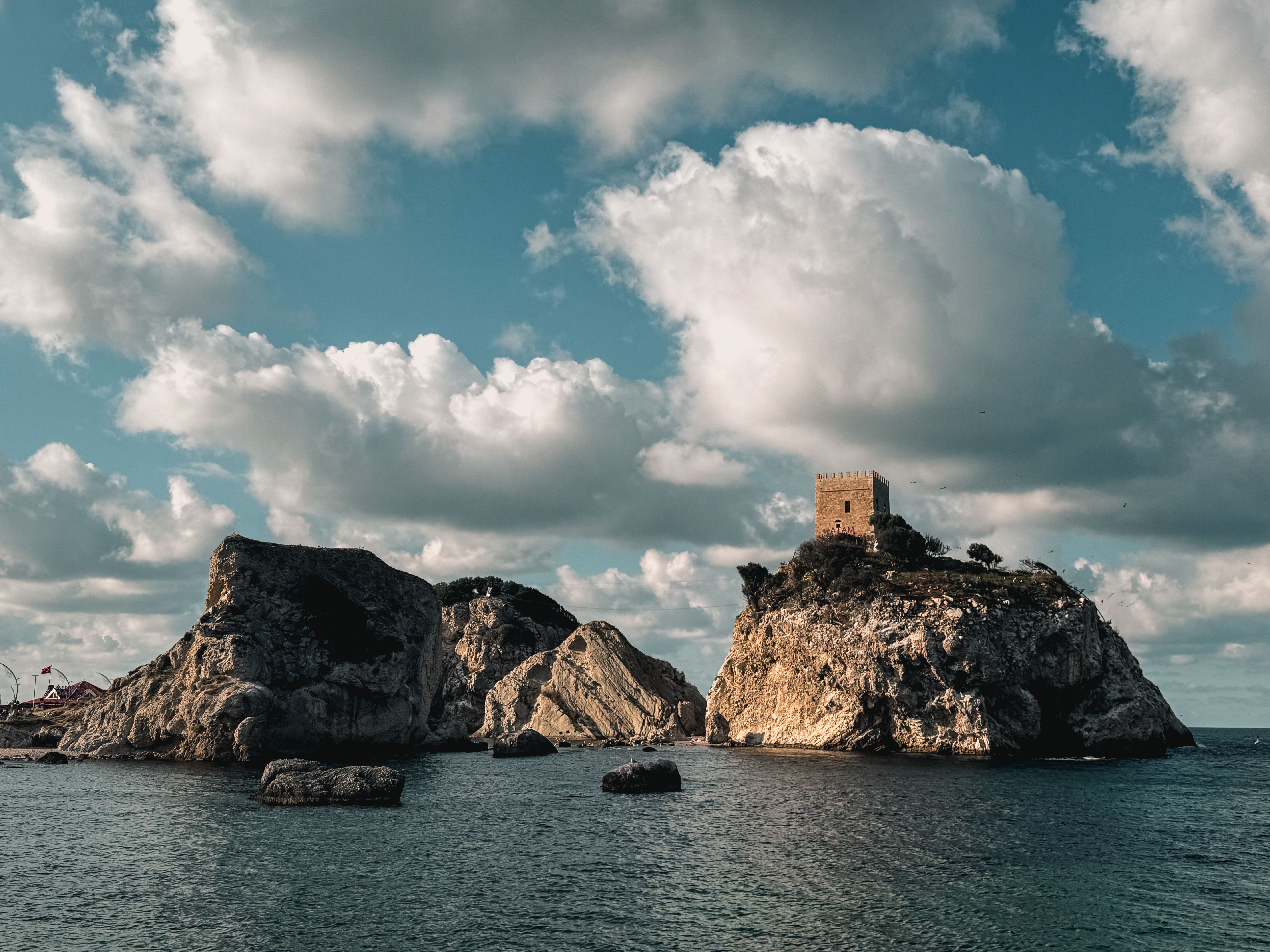 Ancient Coastal Tower on Rocky Island · Free Stock Photo