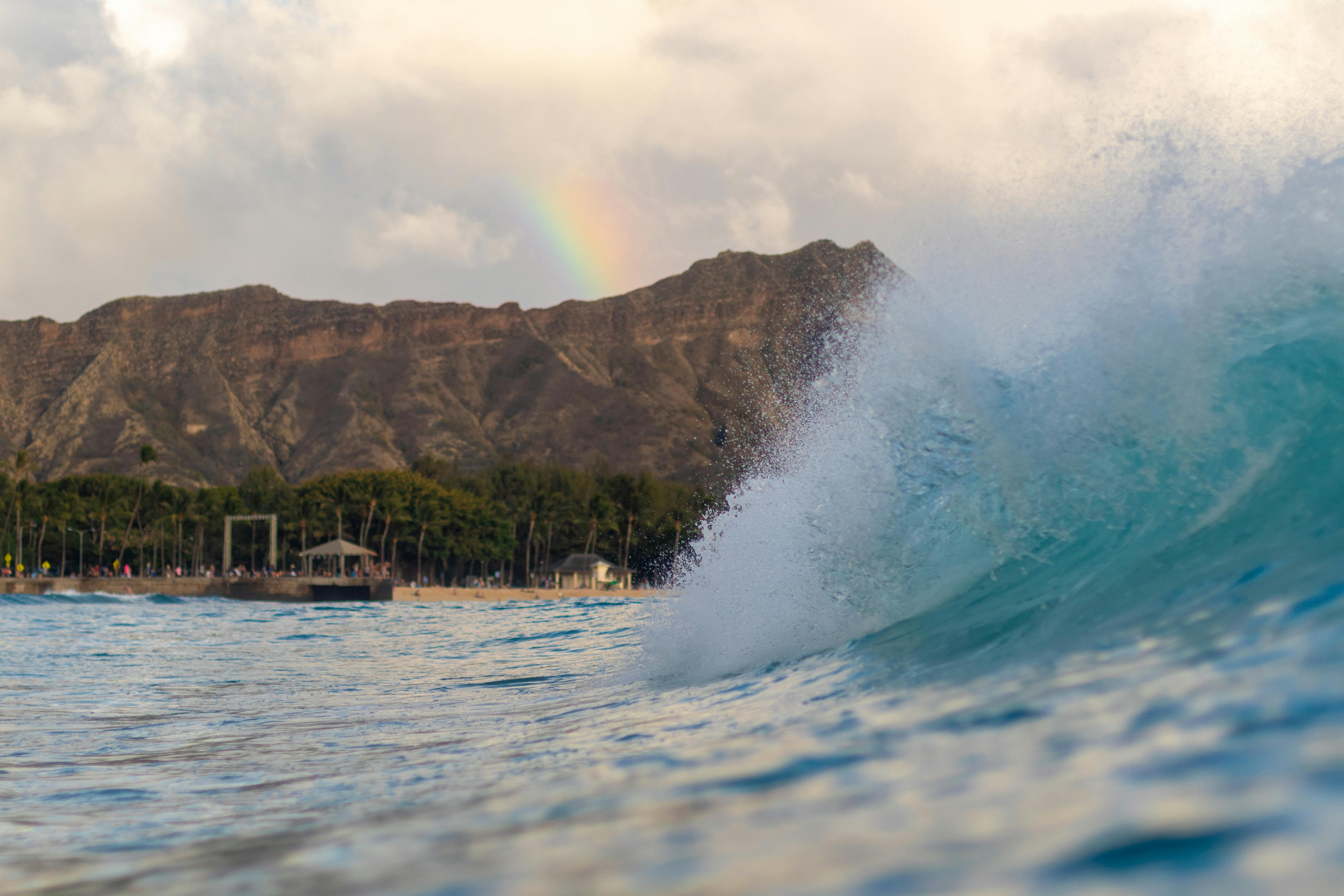 Stunning Waikiki Beach Wave and Rainbow · Free Stock Photo