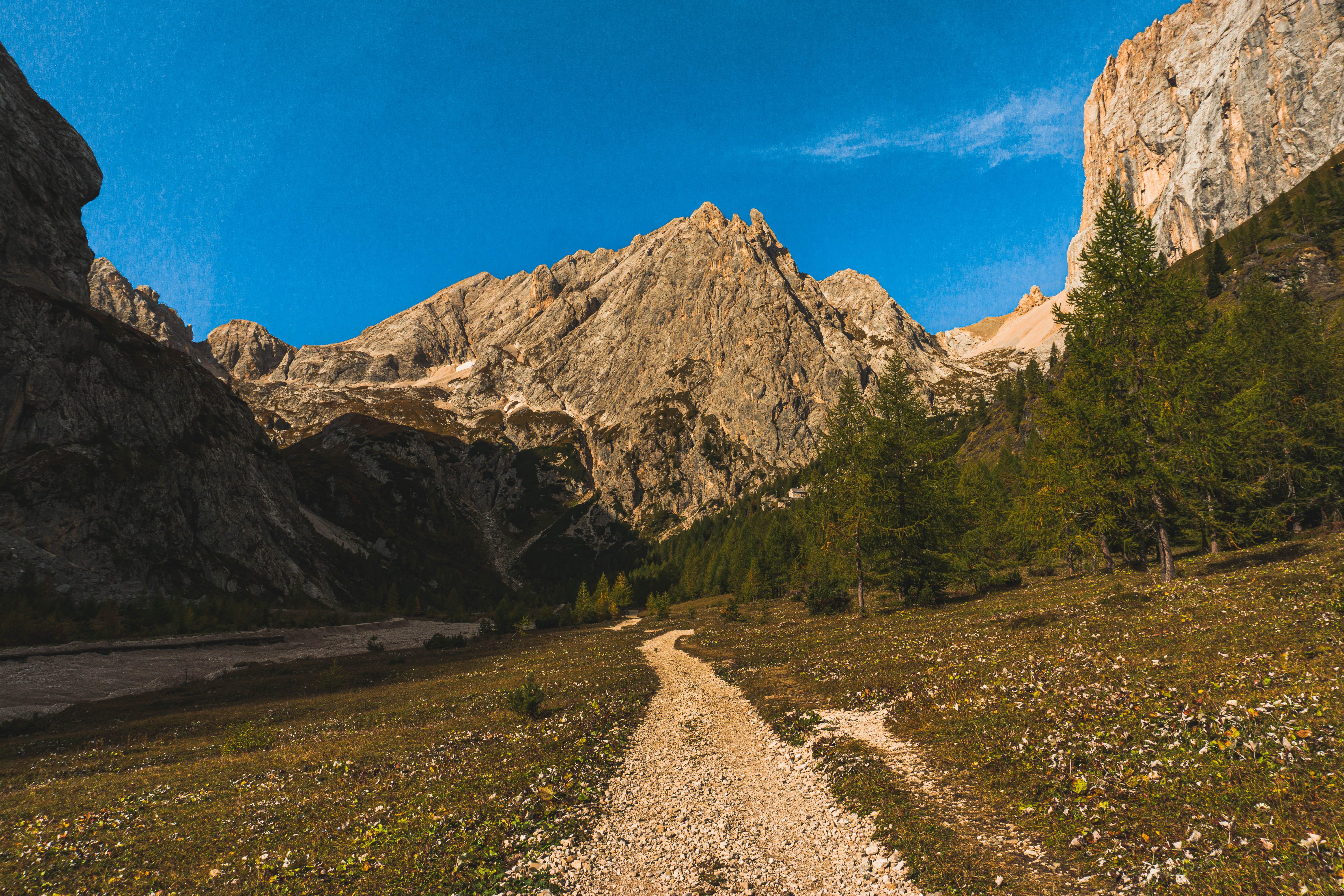 Scenic Mountain Pathway with Clear Blue Sky · Free Stock Photo