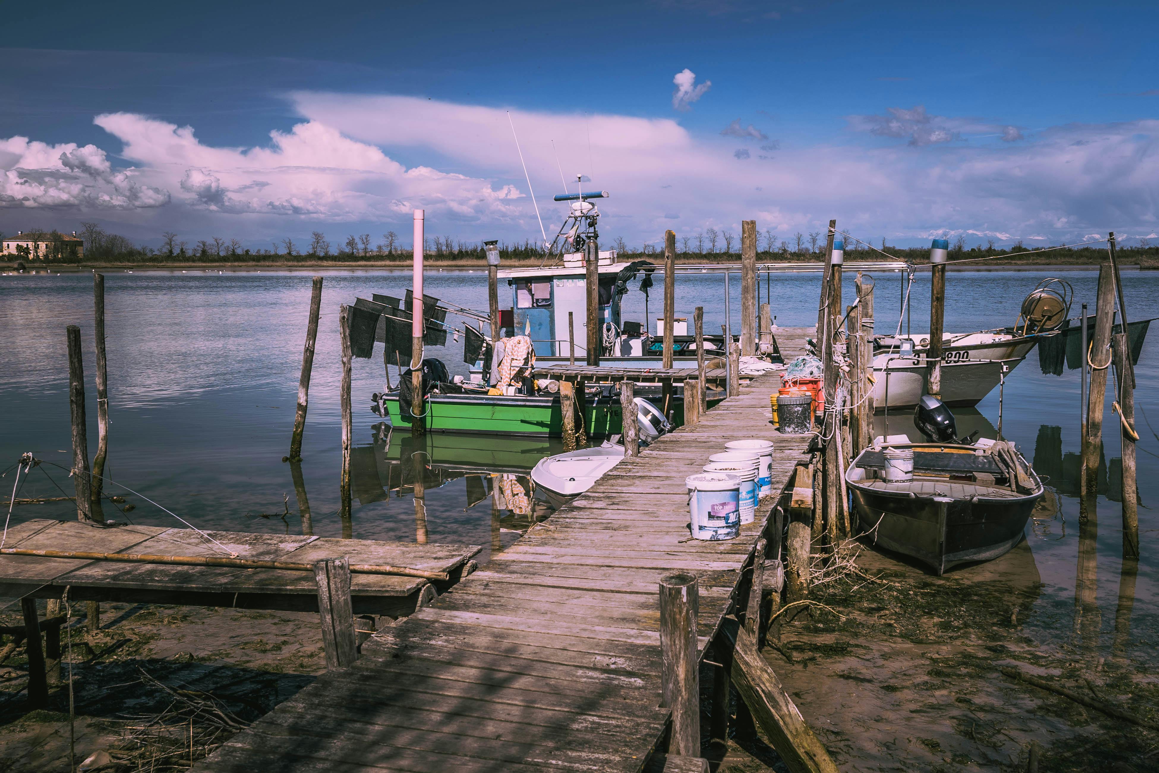 Rustic Wooden Dock with Fishing Boats by Lake · Free Stock Photo