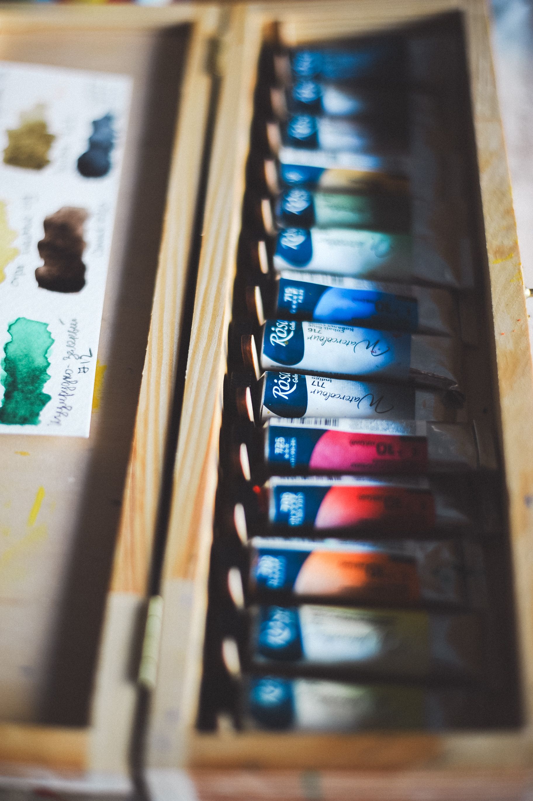 Colorful watercolor tubes in an artist's studio · Free Stock Photo