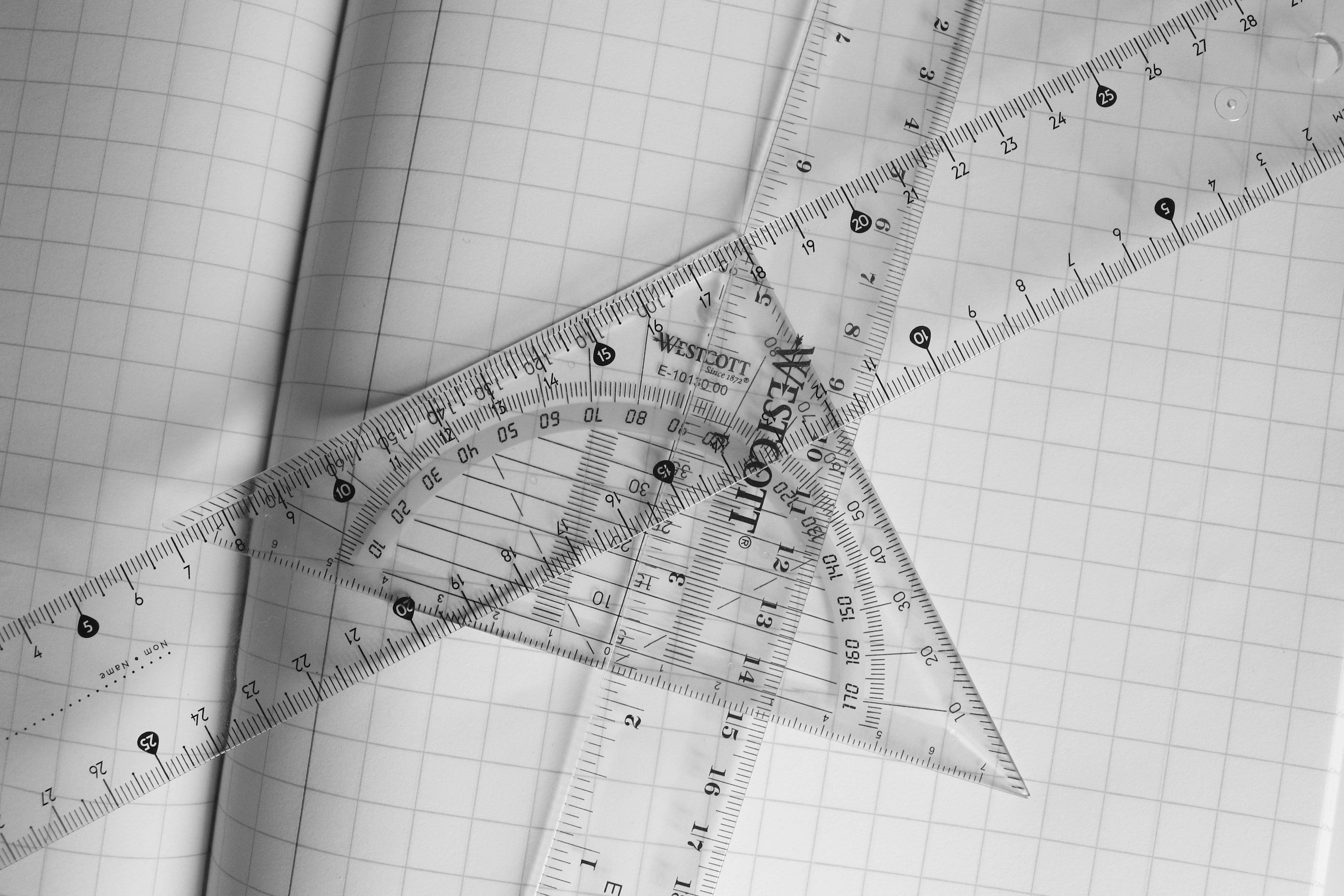 Geometric Tools on Graph Paper in Monochrome · Free Stock Photo