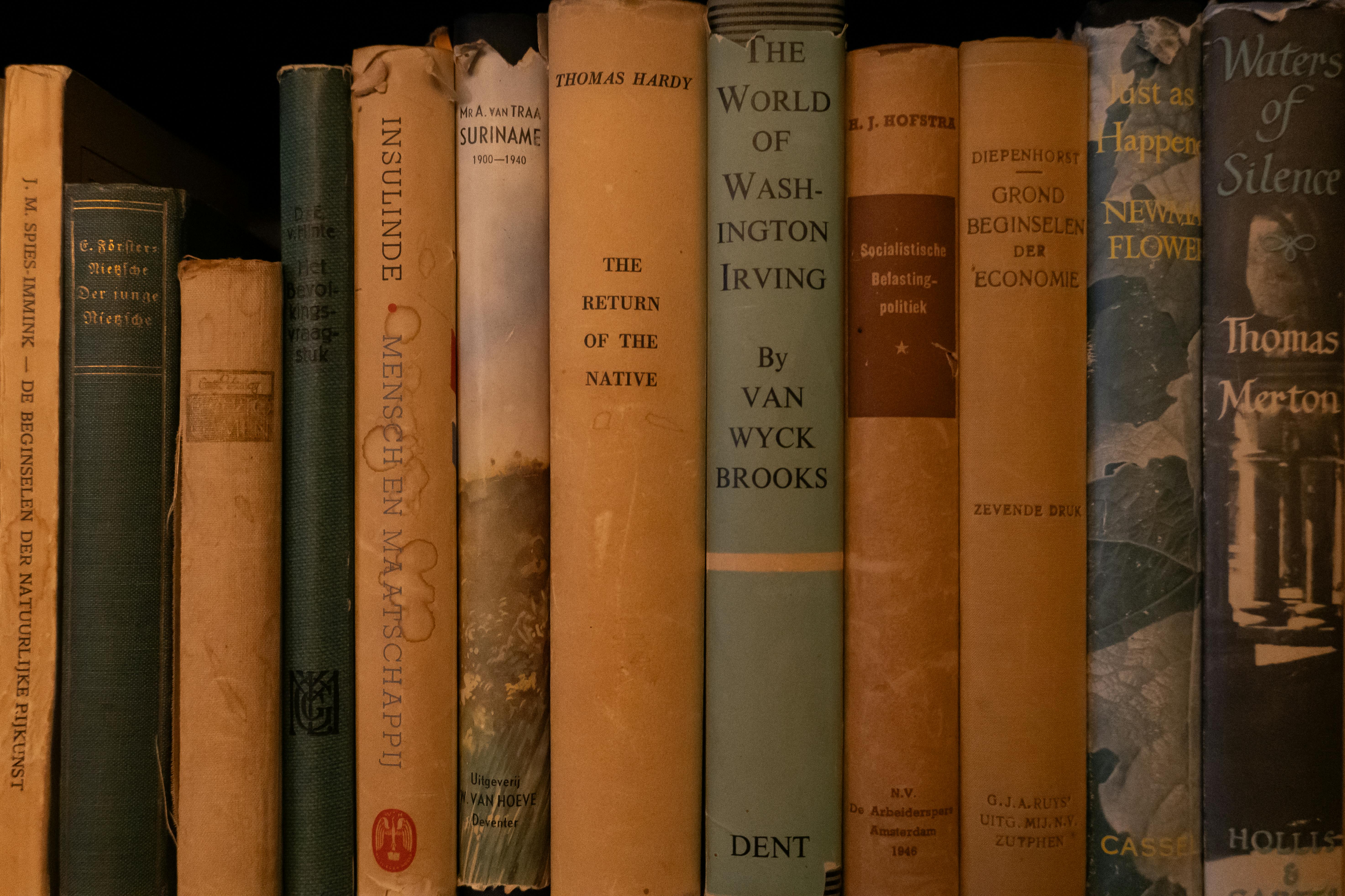 Vintage Books on a Shelf Close-Up · Free Stock Photo