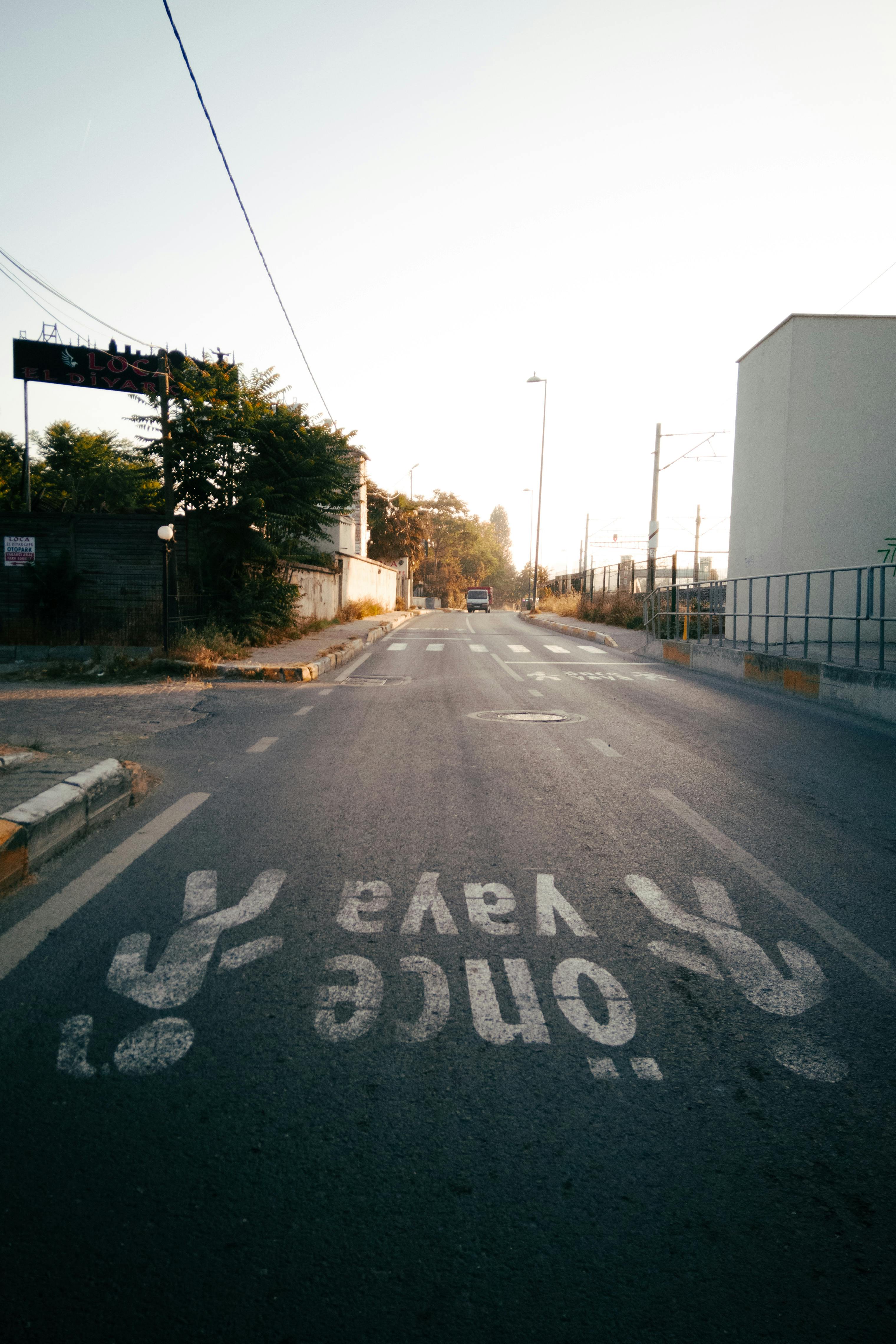 Urban Road at Sunrise with Pedestrian Markings · Free Stock Photo