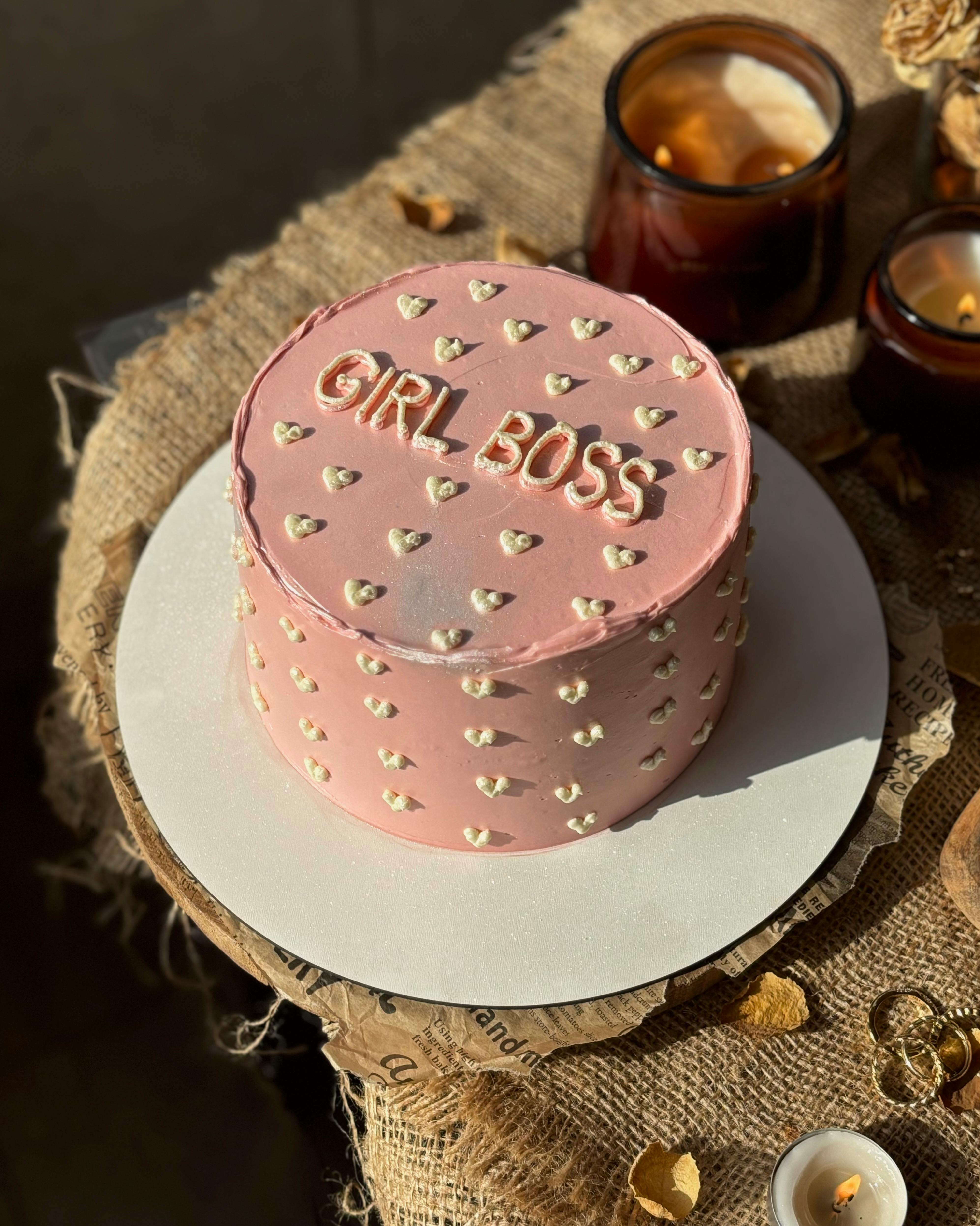 Pink 'Girl Boss' Cake with Heart Decorations · Free Stock Photo