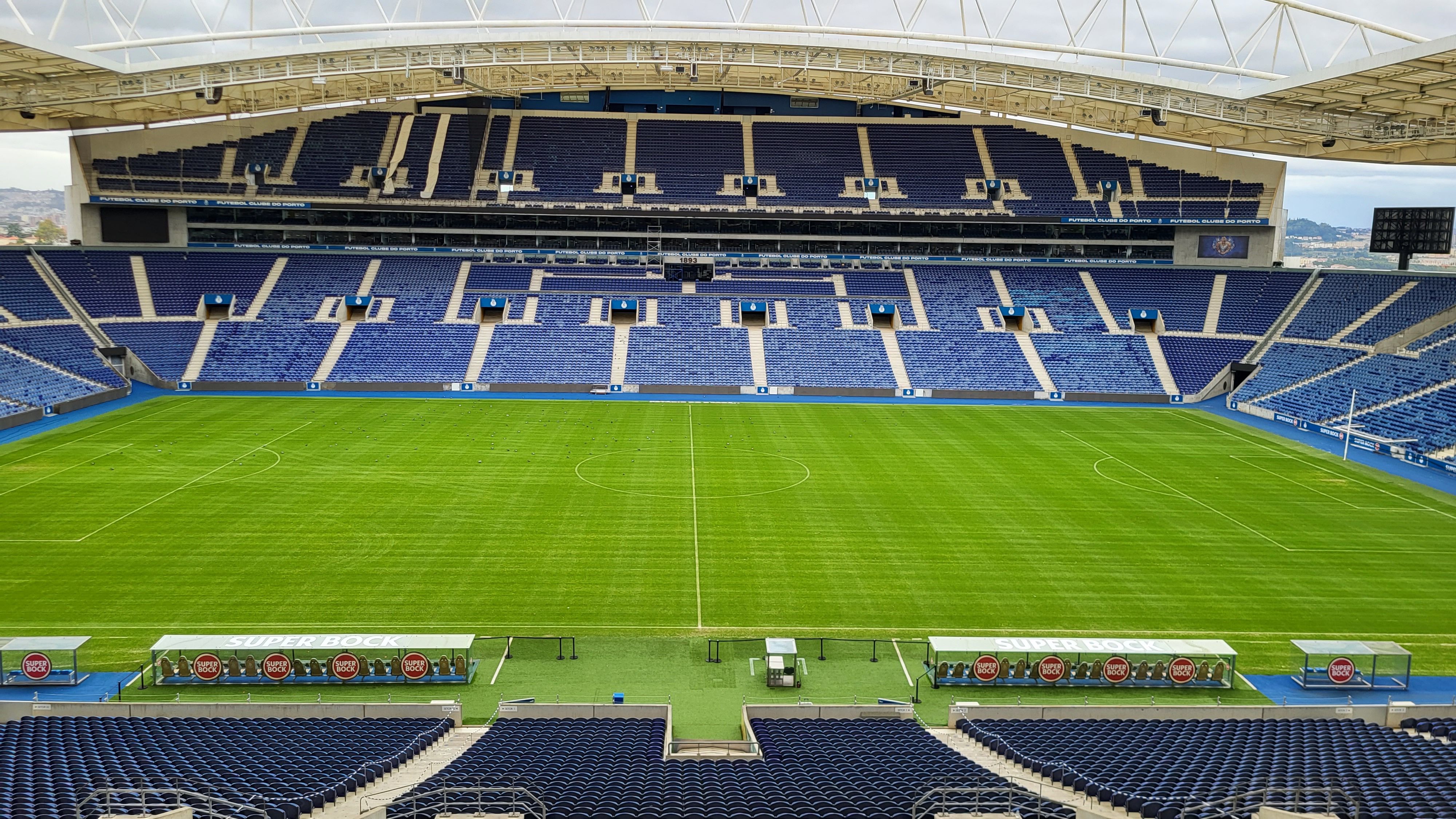 Empty Soccer Stadium with Green Field and Roof · Free Stock Photo