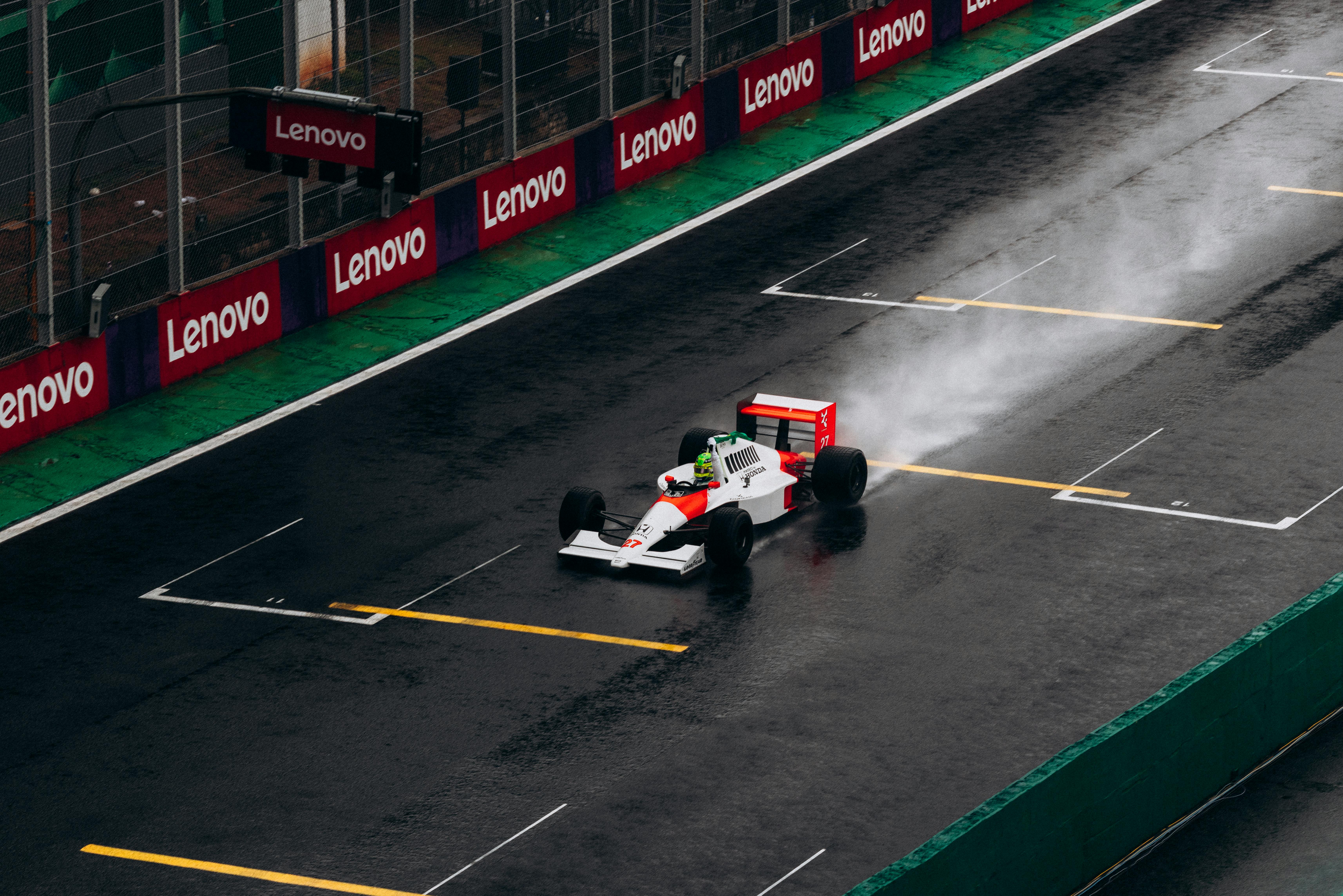 Rainy Formula 1 Race Car Speeding at Interlagos · Free Stock Photo