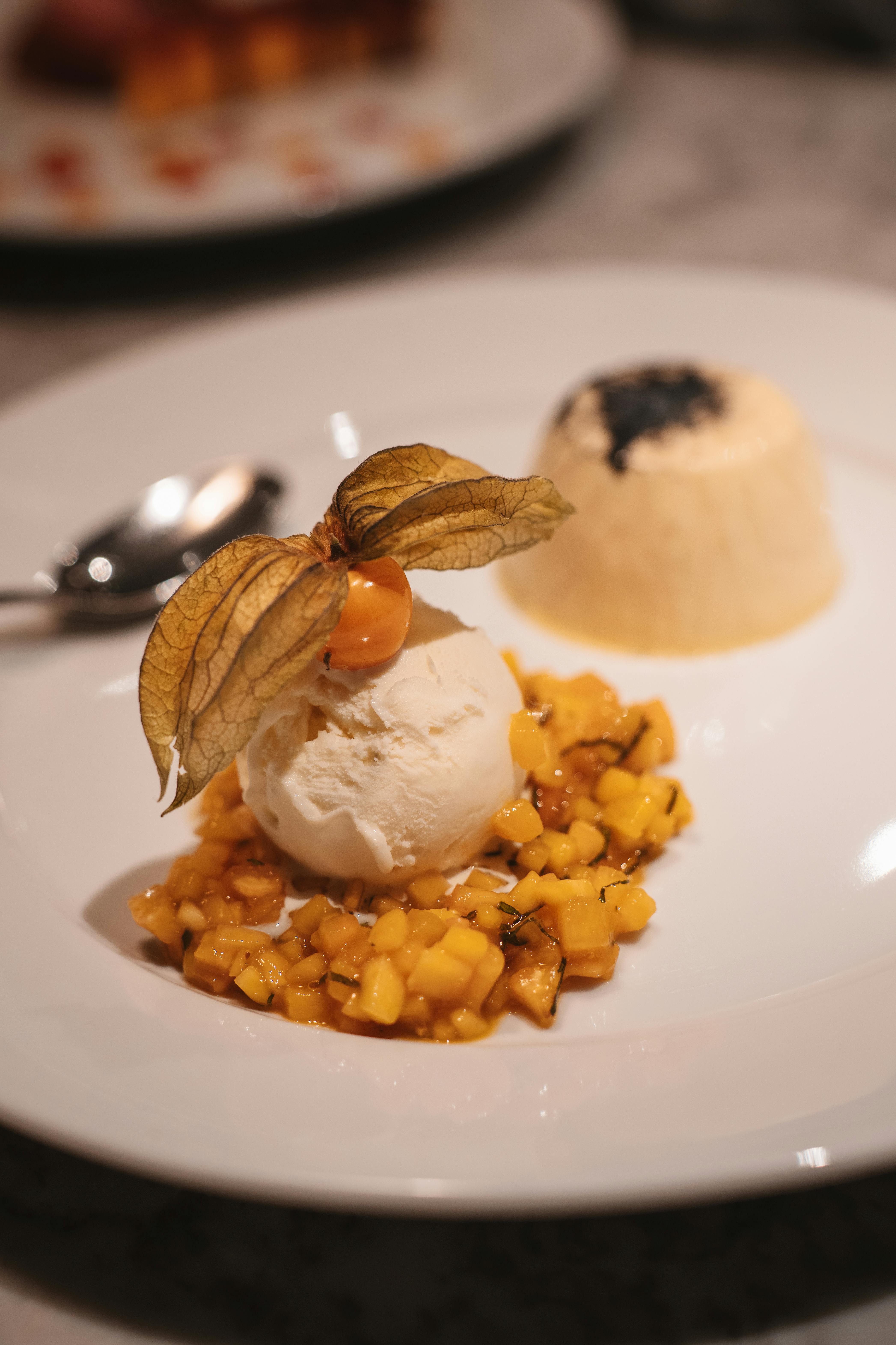 Elegant Dessert with Ice Cream and Mango Garnish · Free Stock Photo