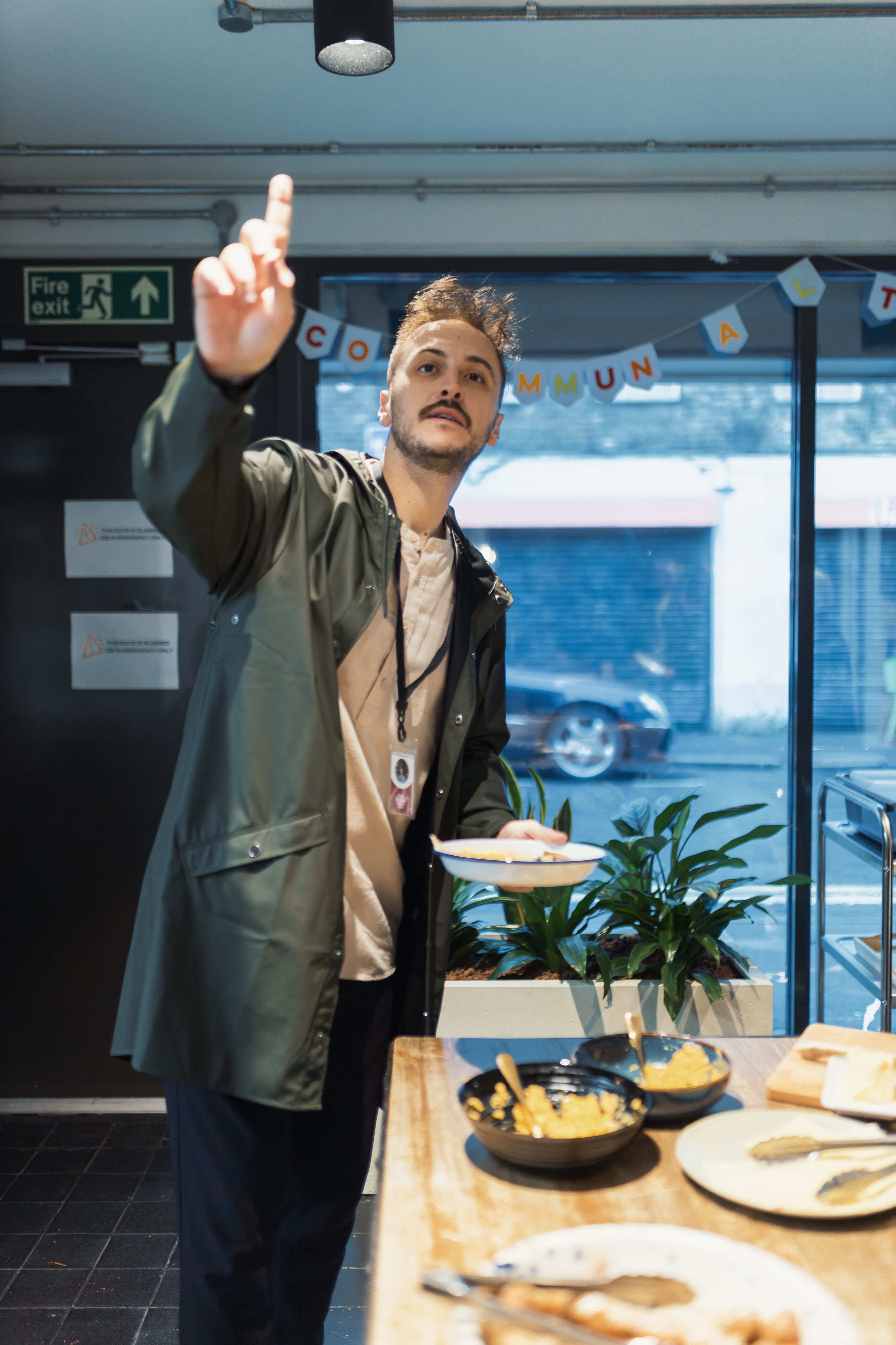 Man Enjoying Meal Indoors at Social Event · Free Stock Photo