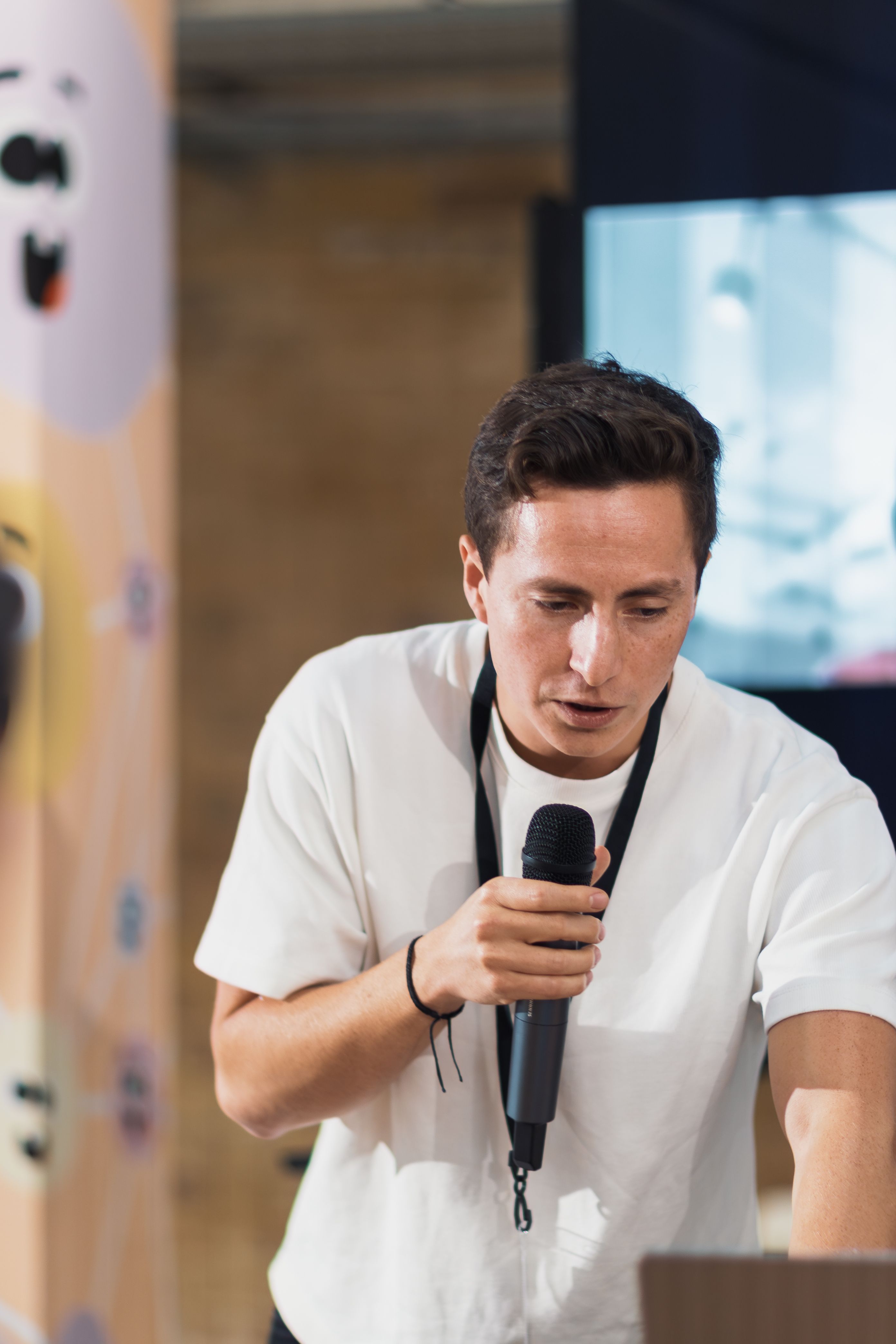 Man Speaking at Indoor Business Conference · Free Stock Photo
