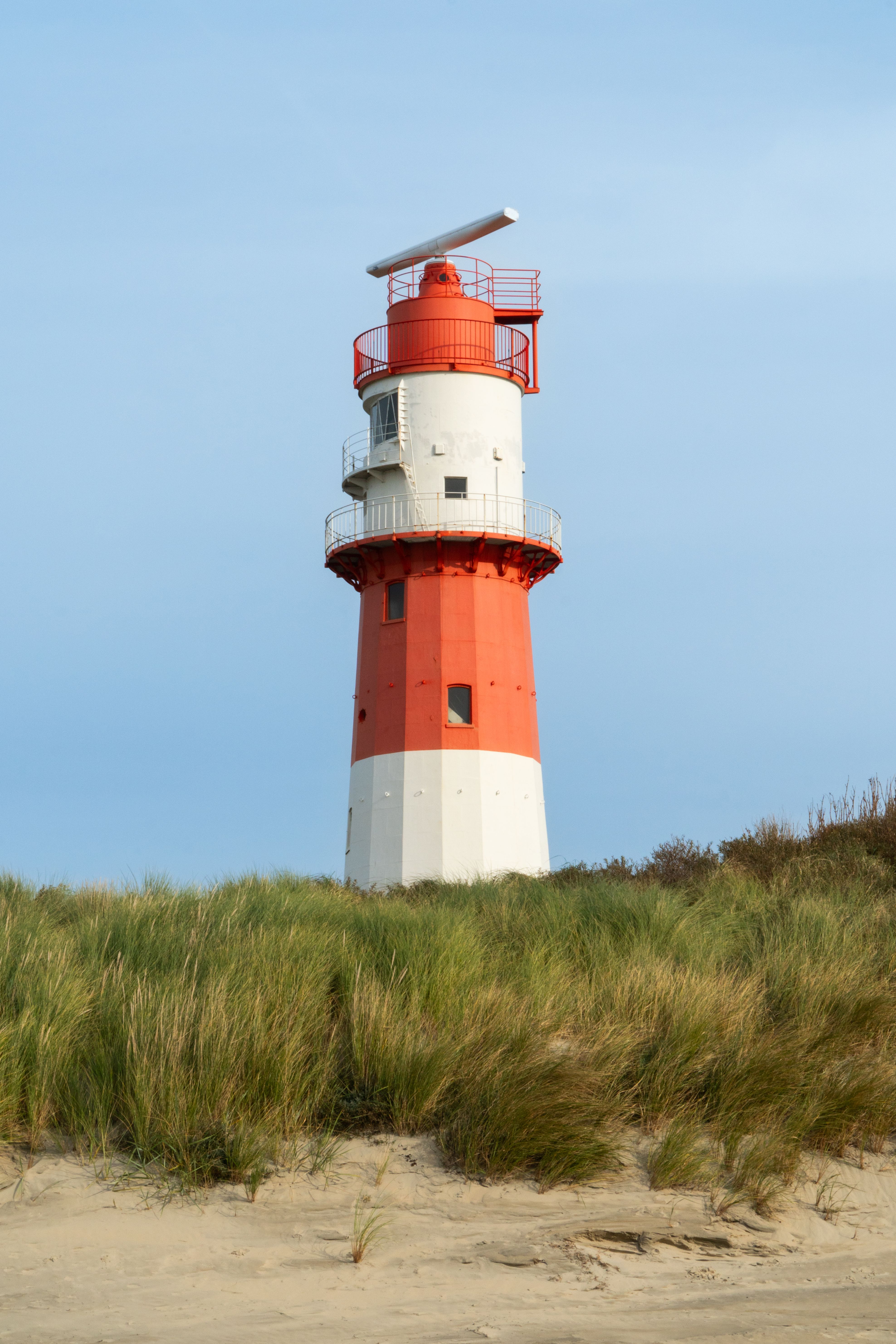 Red and White Lighthouse on Borkum Dunes · Free Stock Photo